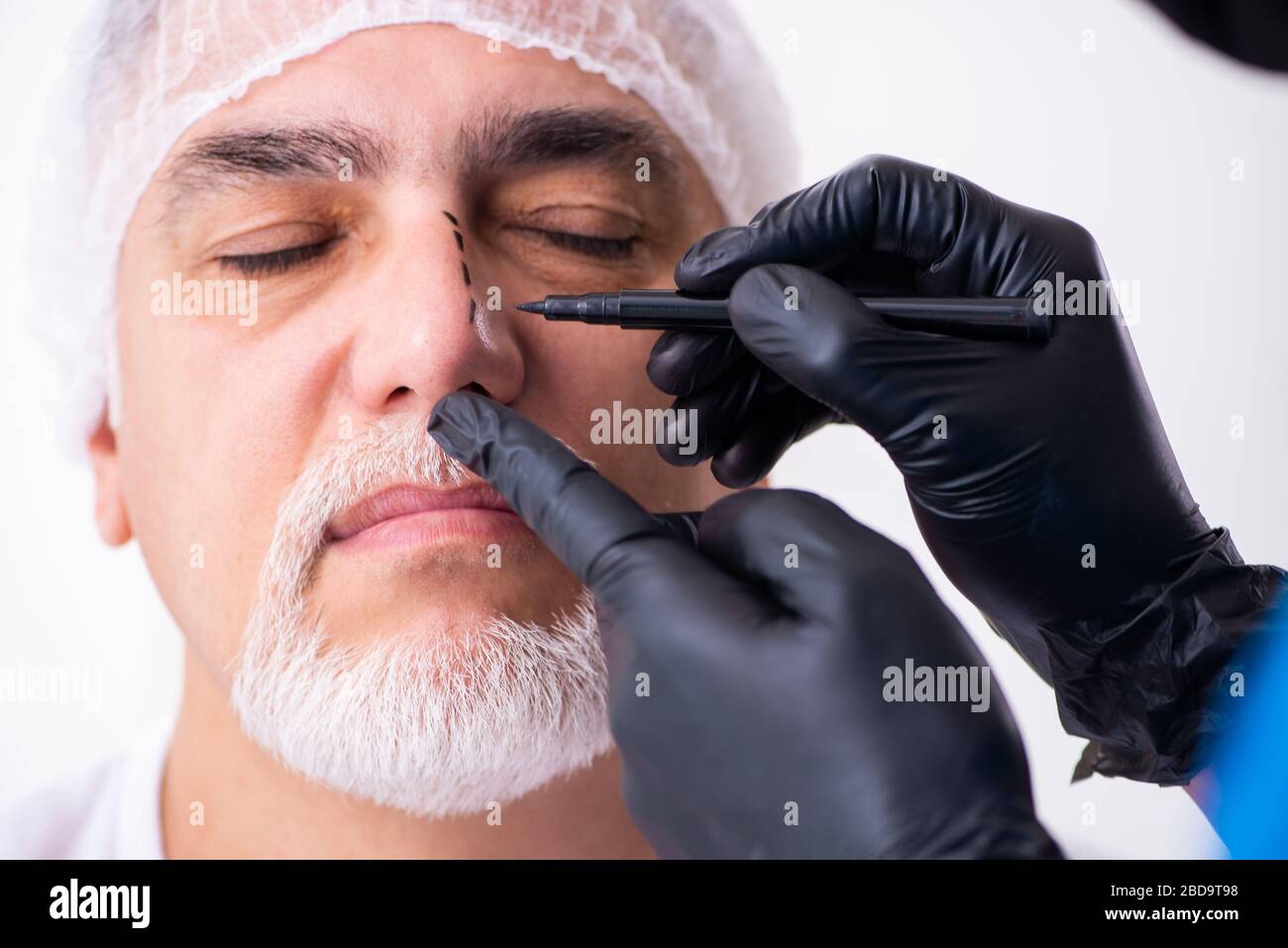 Old man visiting doctor for plastic surgery Stock Photo - Alamy