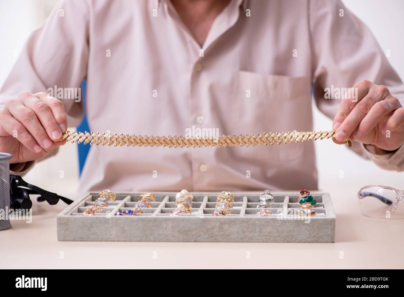Old jeweler at the workshop Stock Photo - Alamy