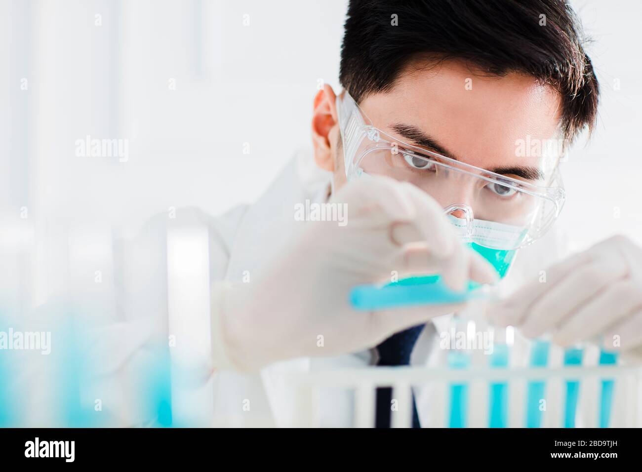 scientist in the laboratory working at lab with test tubes Stock Photo ...