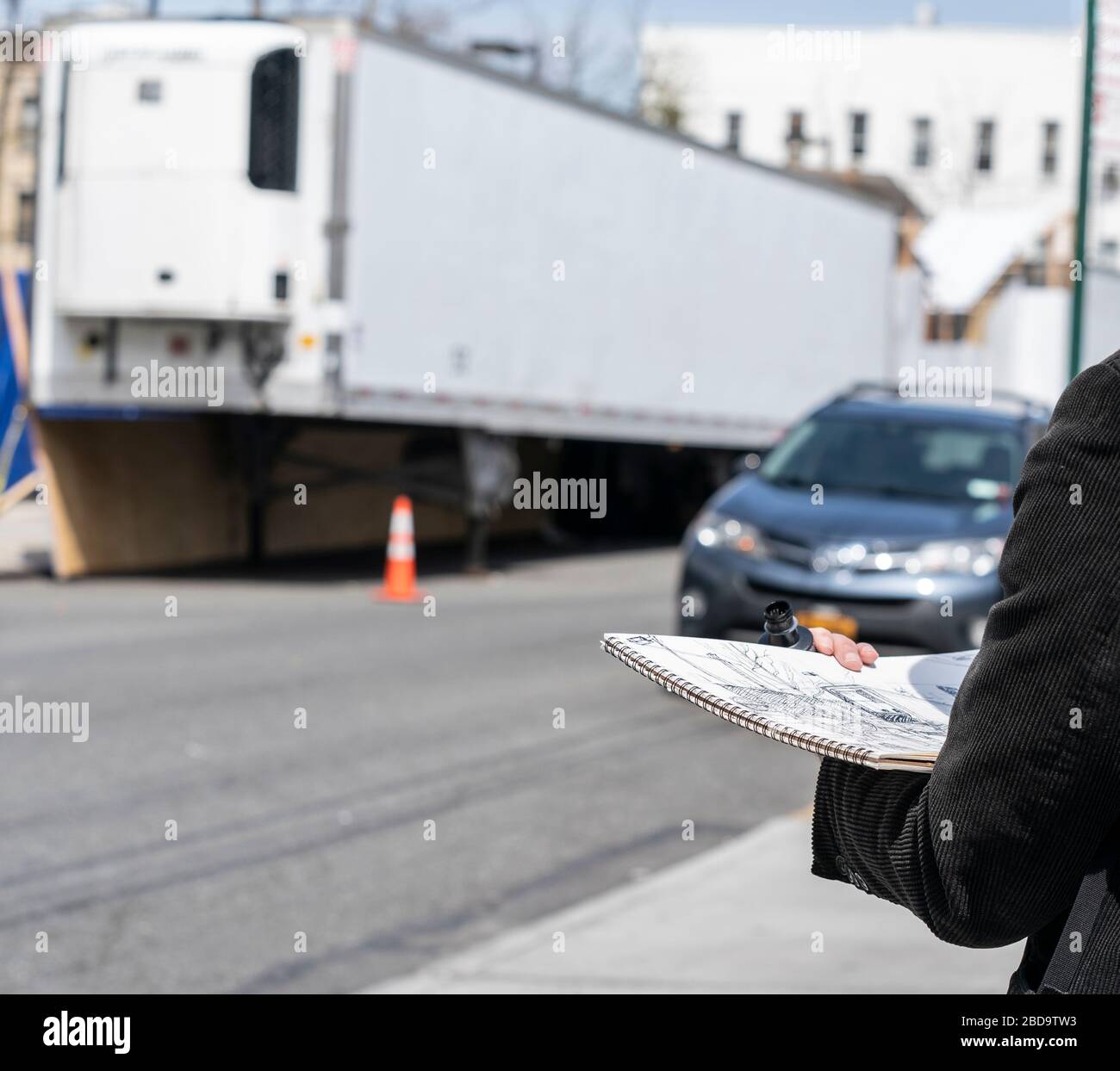 New York, NY - April 7, 2020: An artist makes drawing of makeshift ...