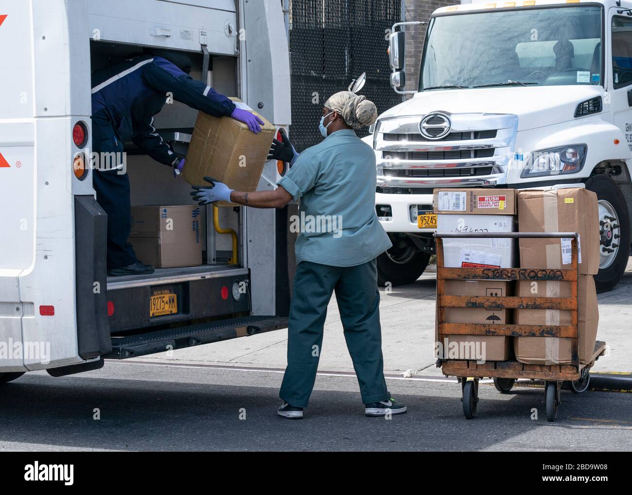 New York, NY - April 7, 2020: FedEx worker is making delivery amid ...