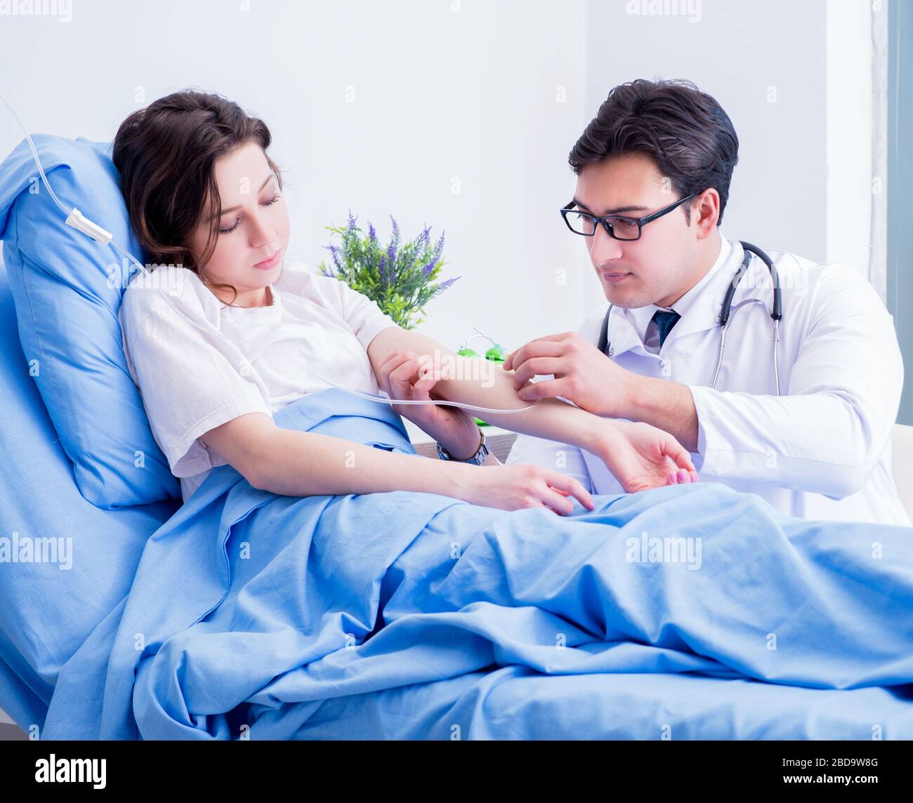 The doctor doing medical injection in hospital room Stock Photo - Alamy