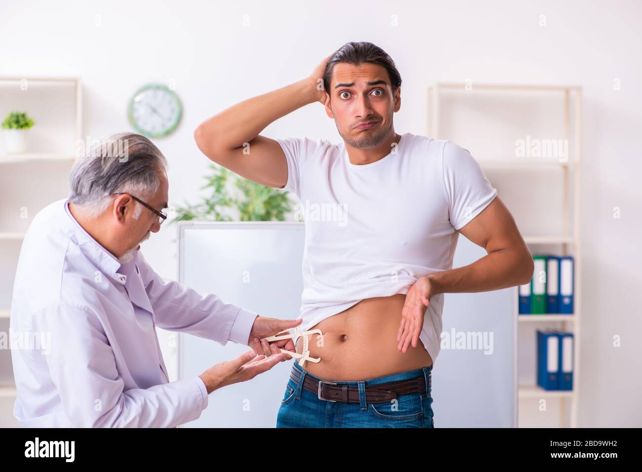 The doctor dietician giving advices to fat overweight patient Stock ...