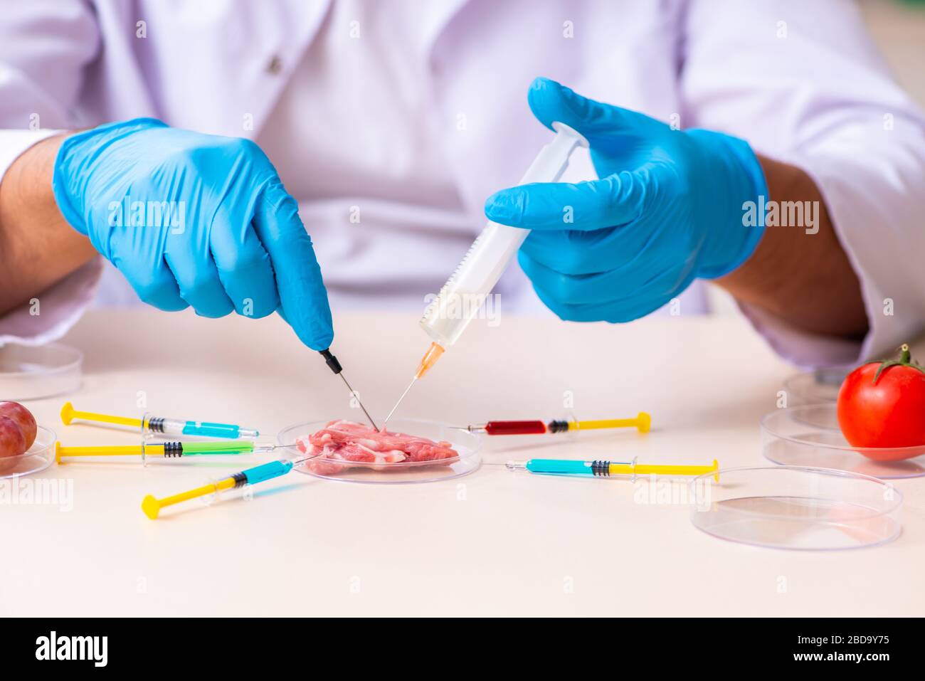 Young nutrition expert testing food products in lab Stock Photo - Alamy