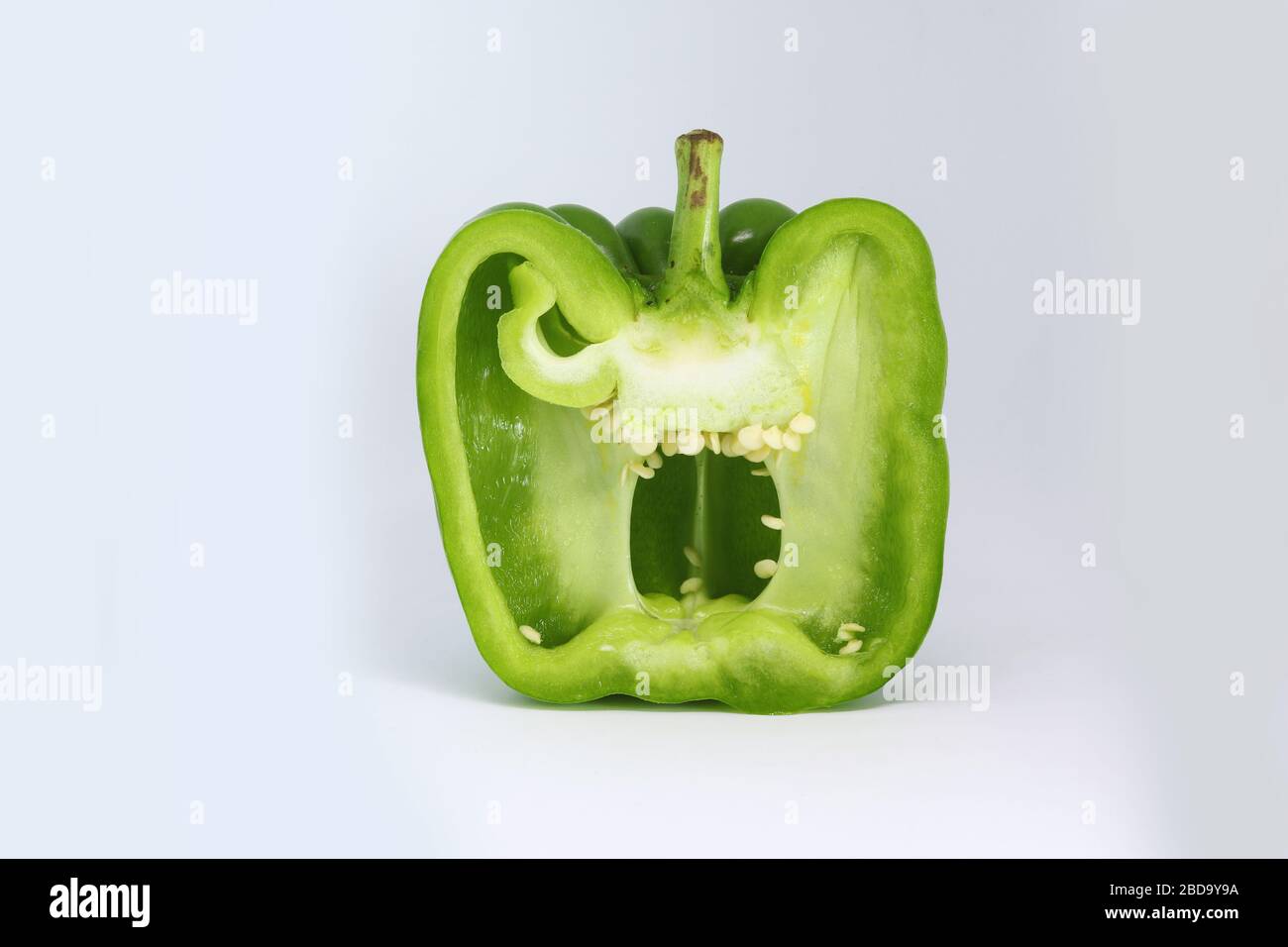 Half cut Capsicum Stock Photo - Alamy