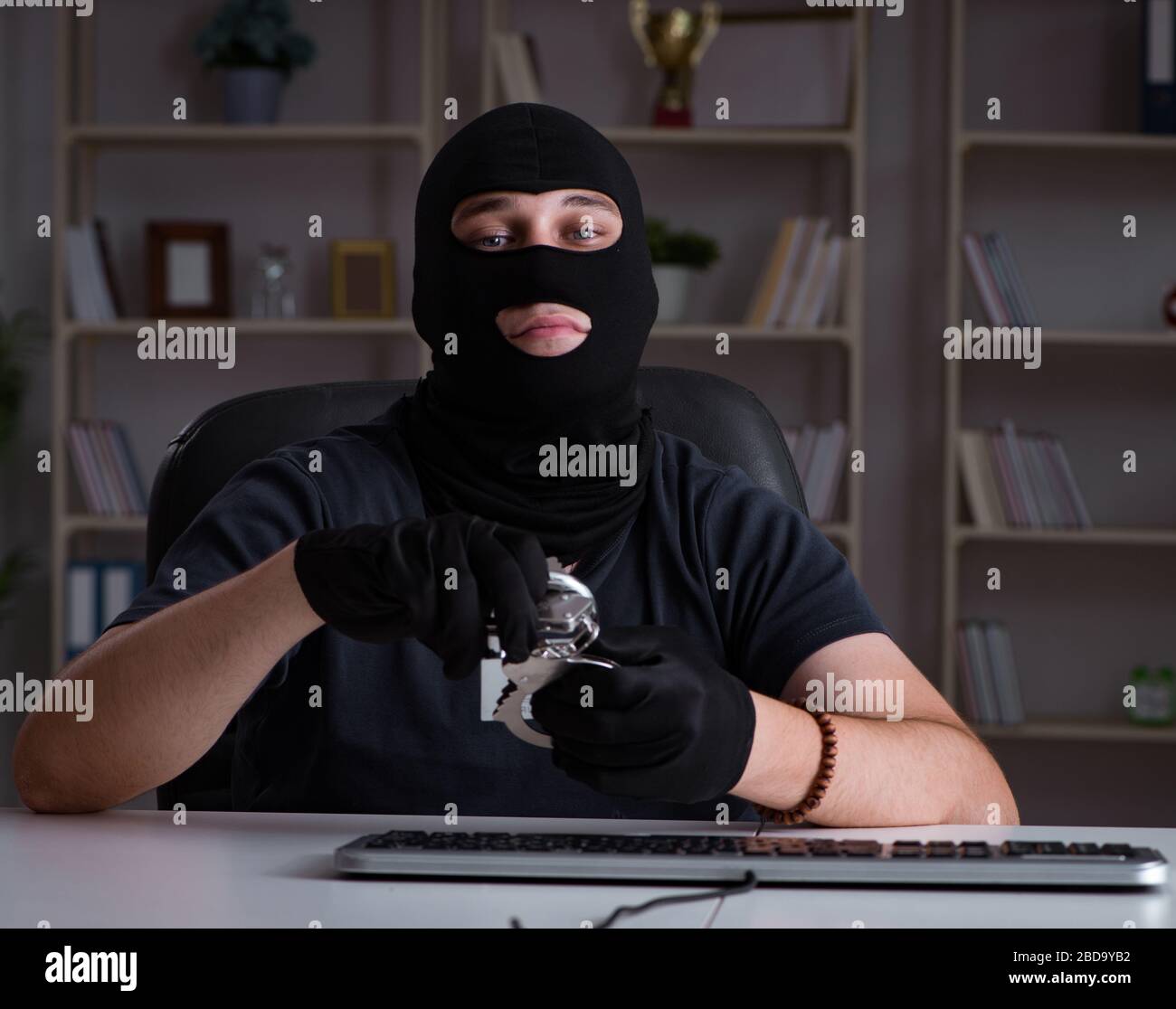 The hacker hacking computer late at night Stock Photo - Alamy