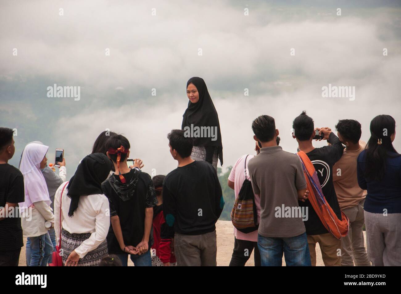 The visitors take photos at Lolai Platform in North Toraja, Indonesia ...