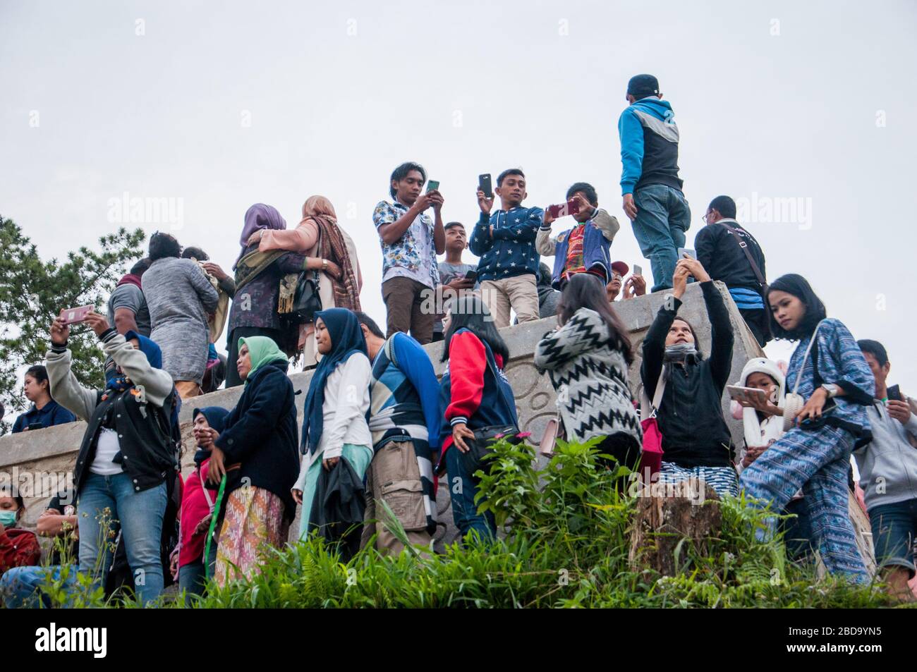The visitors take photos at Lolai Platform in North Toraja, Indonesia ...