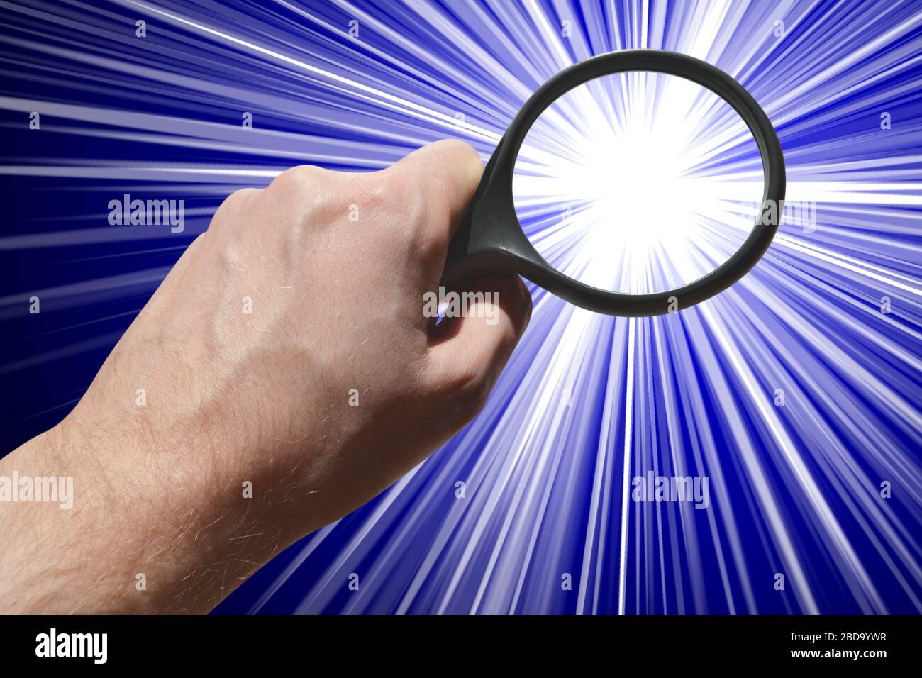 Magnifying glass concept, human hand Stock Photo - Alamy
