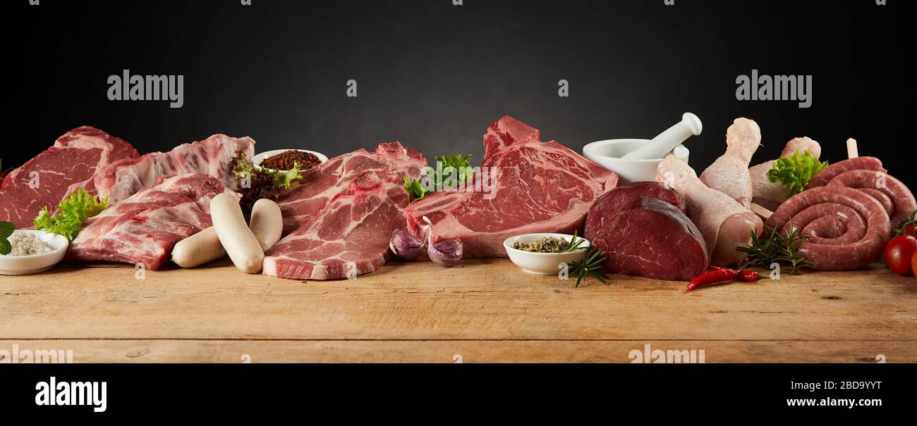 Display of assorted raw meats for barbecuing or grilling with pork ...