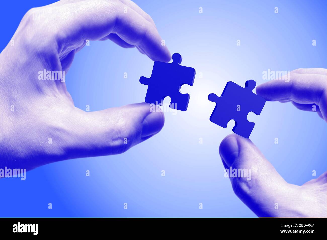 Hands holding jigsaw puzzle pieces - connection concept Stock Photo - Alamy Hands holding jigsaw puzzle pieces - connection concept Stock Photo - Alamy