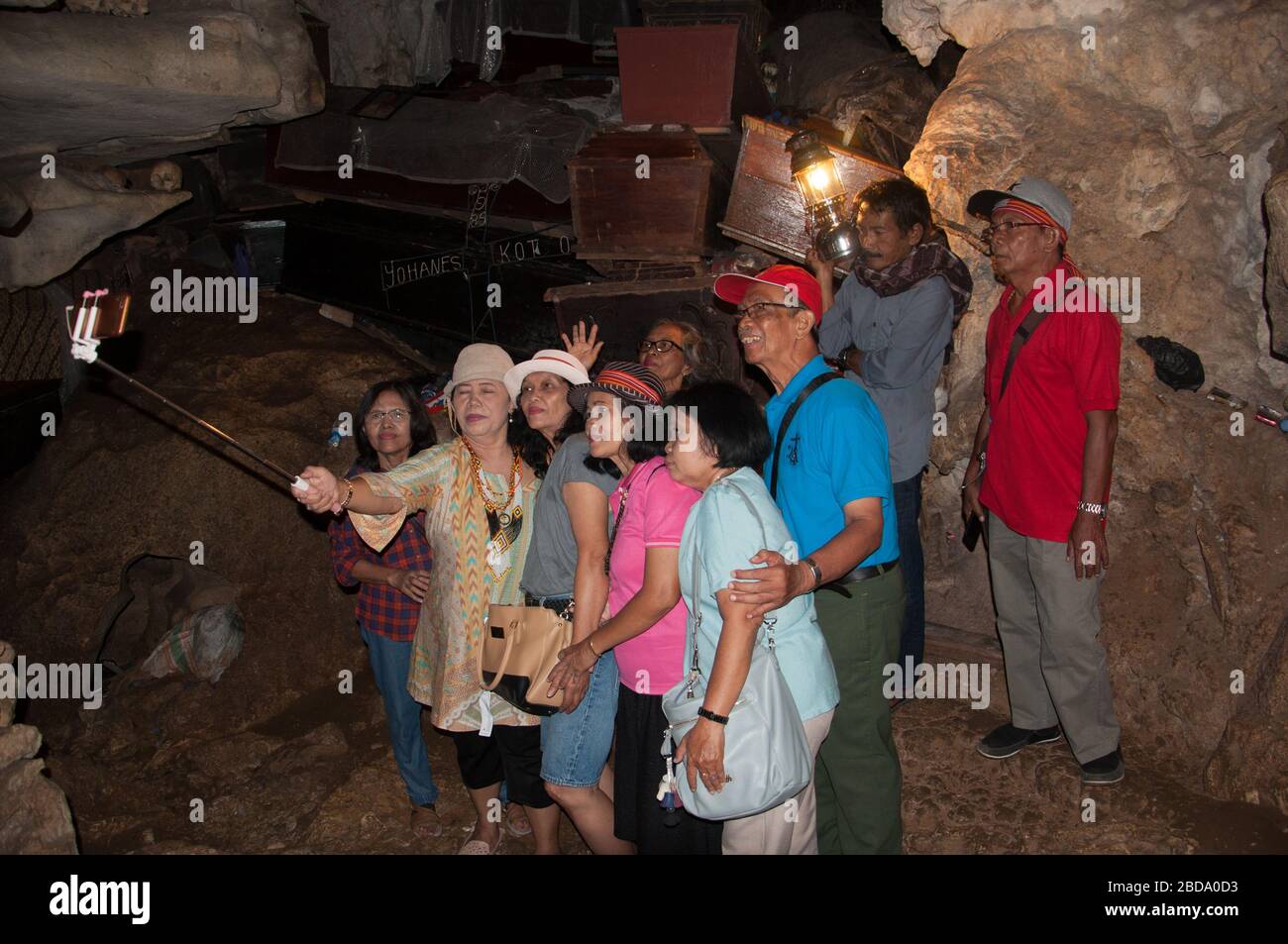The visitors take photos inside the tomb stone of Londa in North Toraja ...