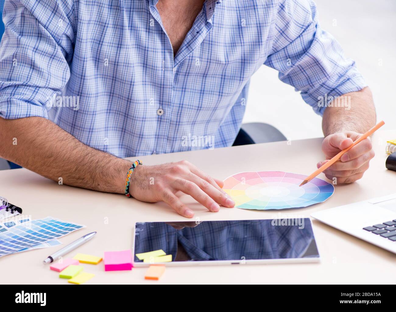 The young designer working in his studio on new project Stock Photo - Alamy