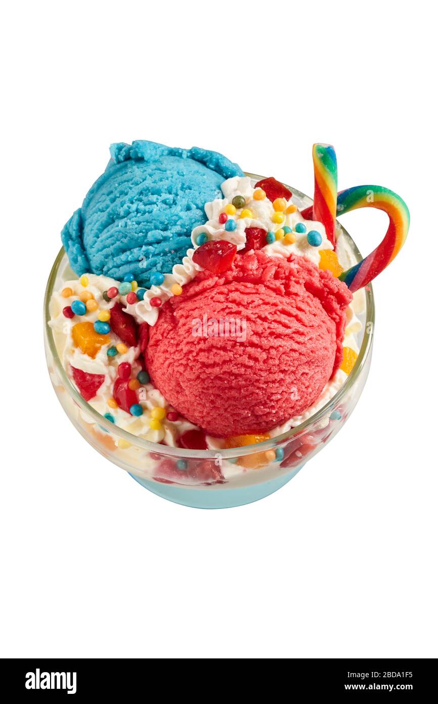 Above view of a colourful, rainbow ice-cream sundae on a white ...