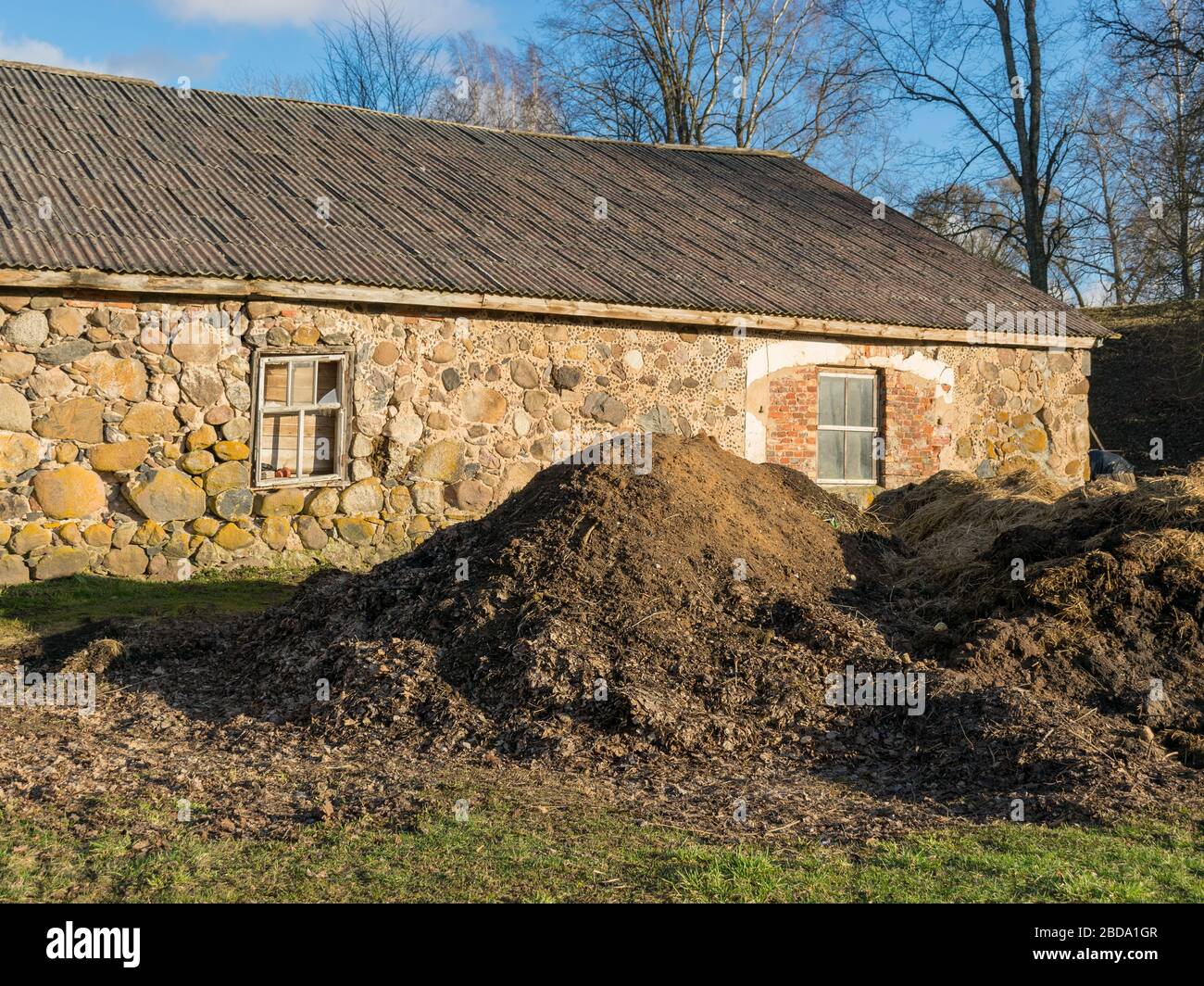 landscape with stone cattle barn, the forefront of the dunghill Stock ...