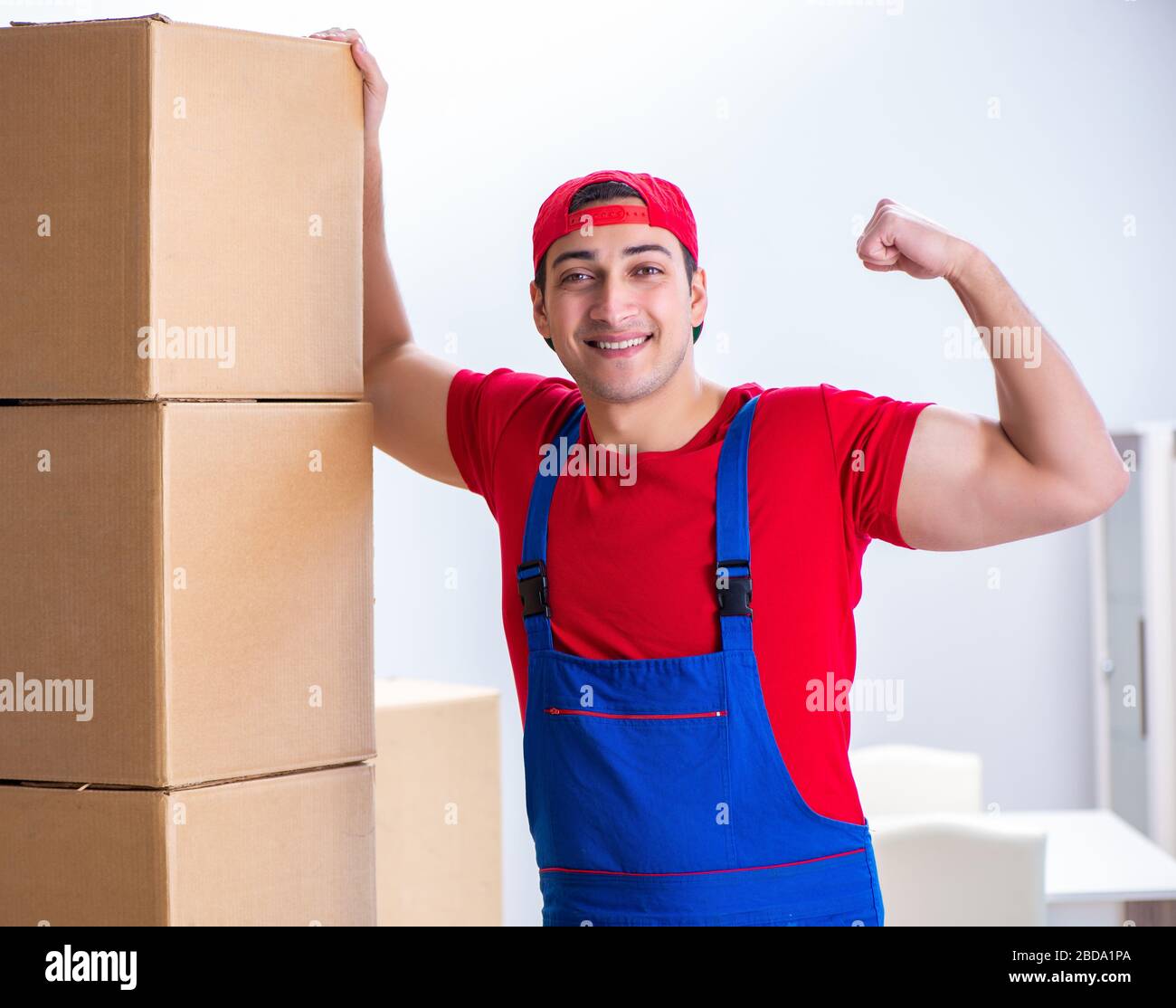 The contractor worker moving boxes during office move Stock Photo - Alamy
