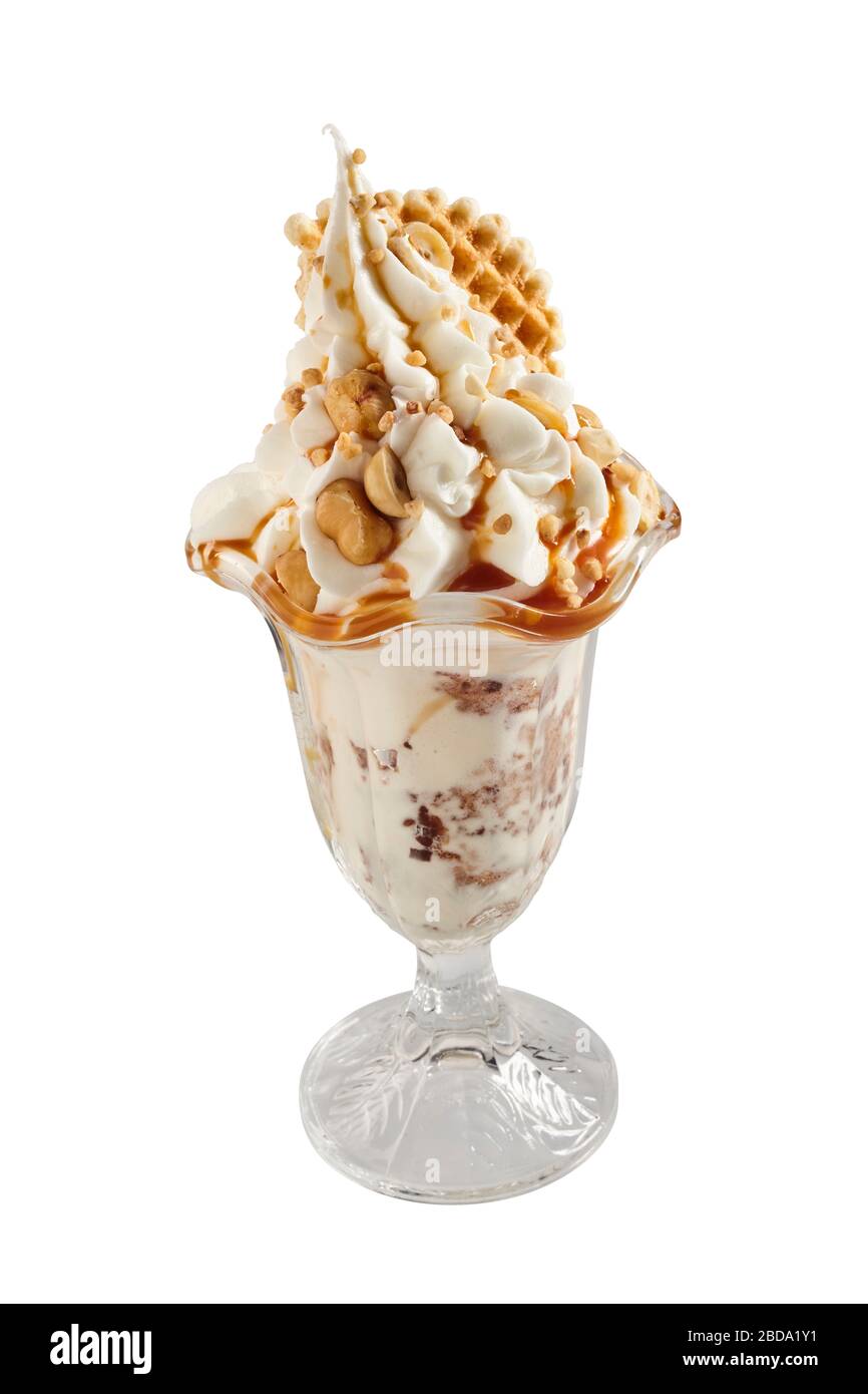 Refreshing vanilla ice cream sundae with chopped hazelnuts and a wafer ...