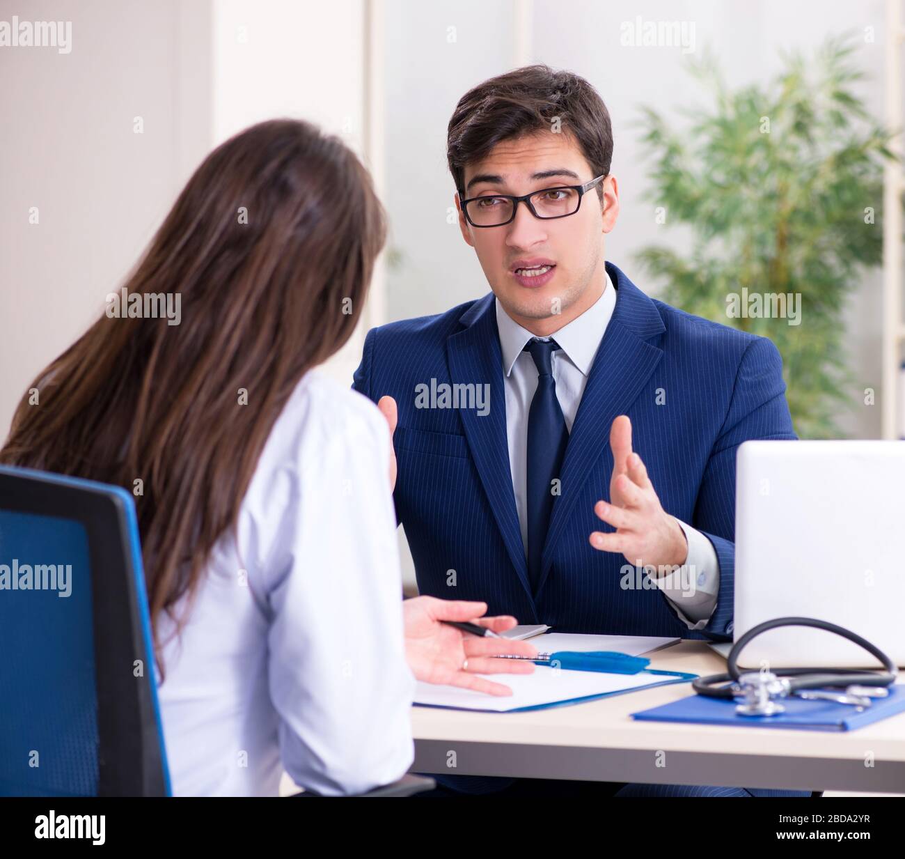 The businessman discussing health issues with doctor Stock Photo - Alamy