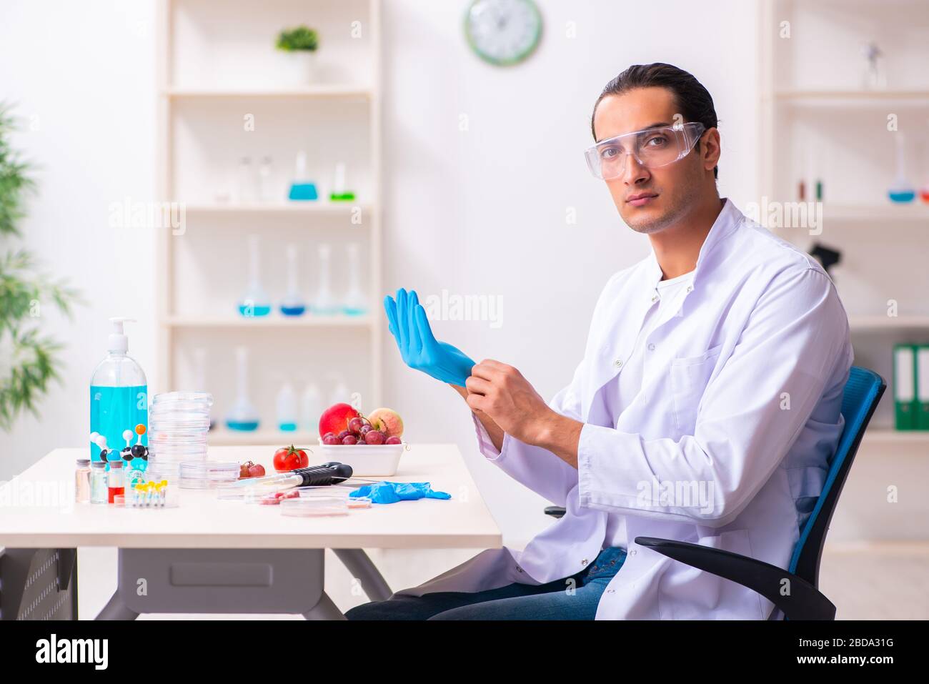 Young nutrition expert testing food products in lab Stock Photo - Alamy