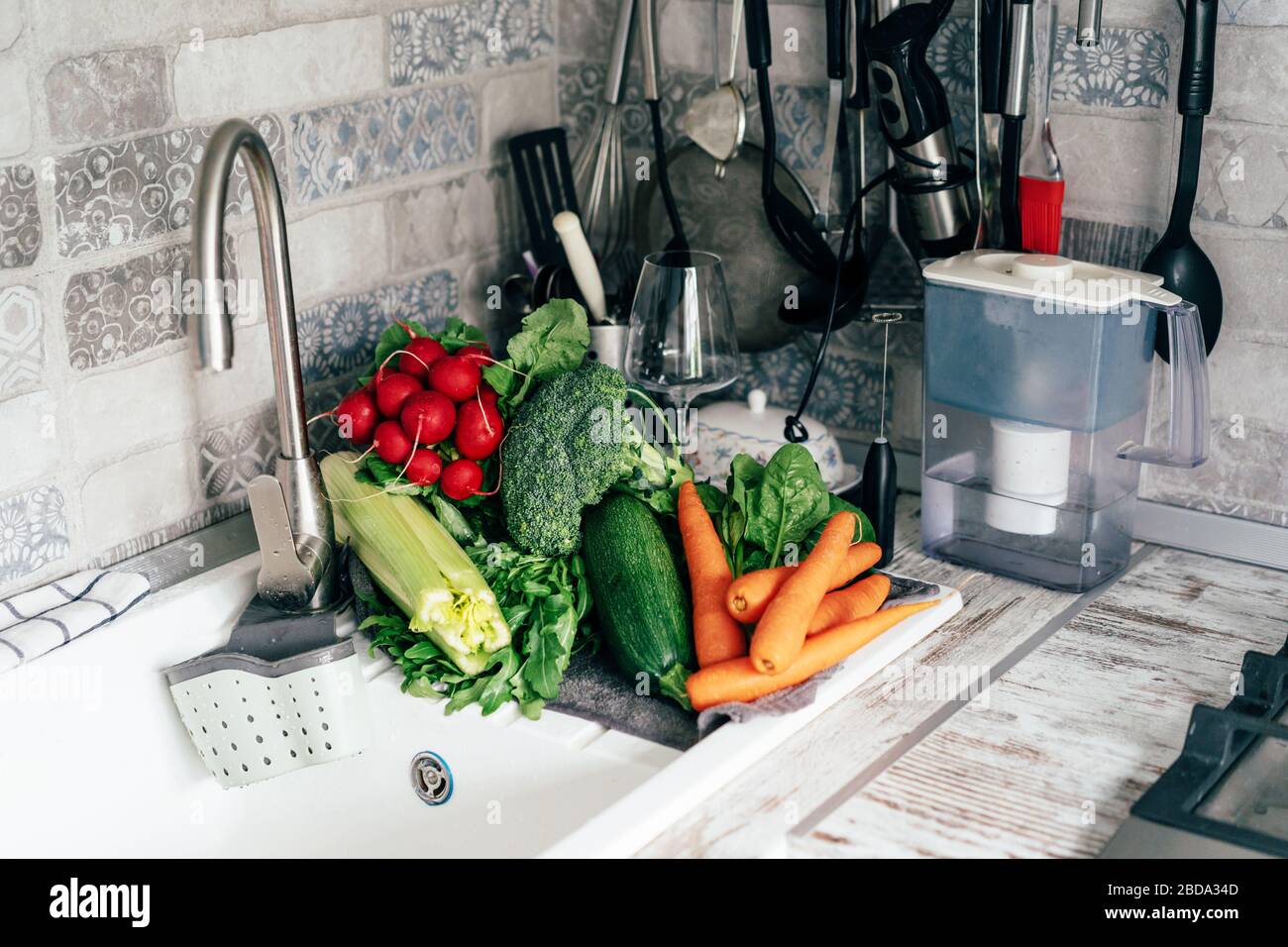 .vegetables in the kitchen sink Stock Photo - Alamy