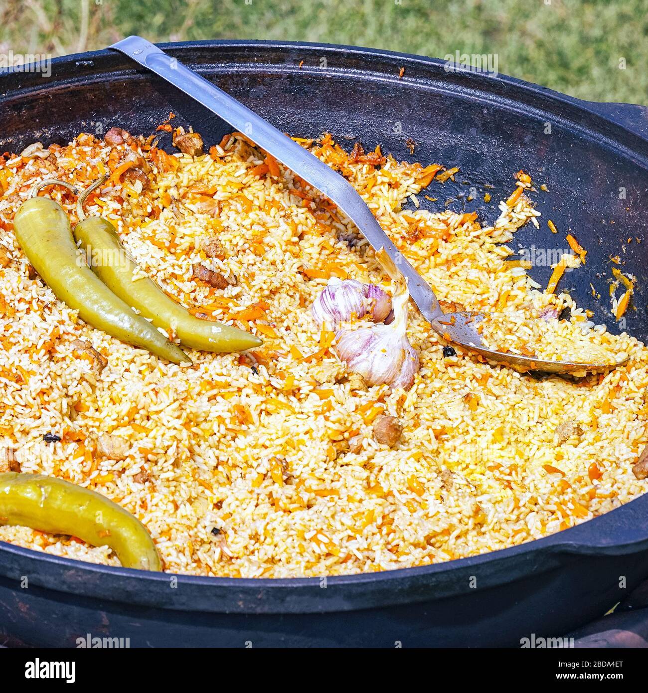 Traditional delicious pilaf with vegetables in a cauldron Stock Photo ...