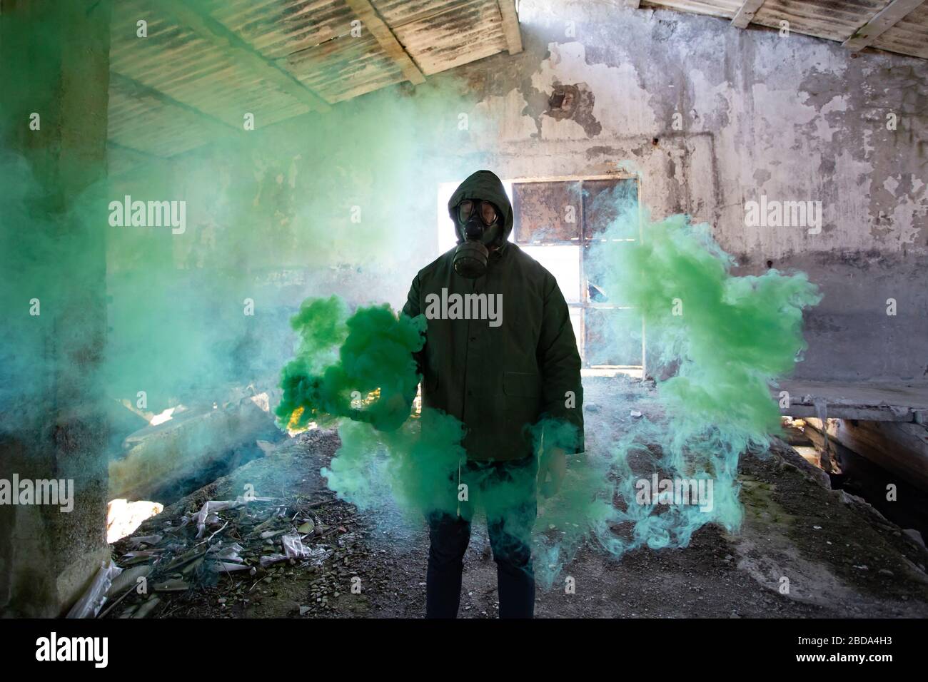 Post apocalyptic survivor in gas mask in the smoke. Environmental ...