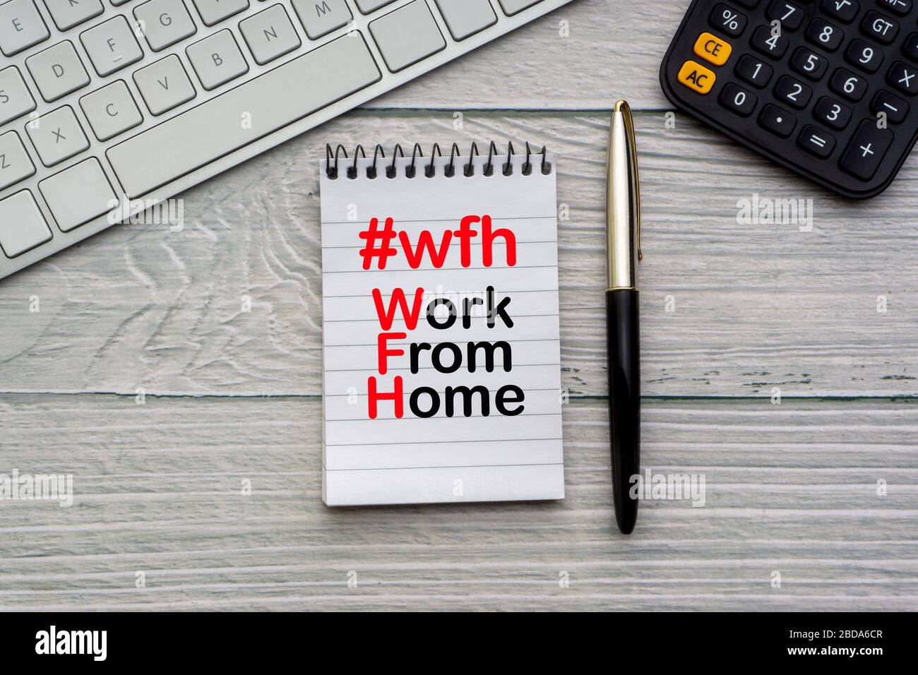 WORK FROM HOME #WFH text with notepad, keyboard, fountain pen and ...