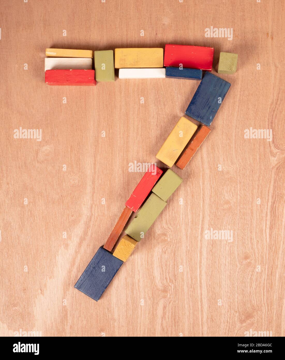 Old wooden blocks, toghether they make the number 7, isolated on wood ...