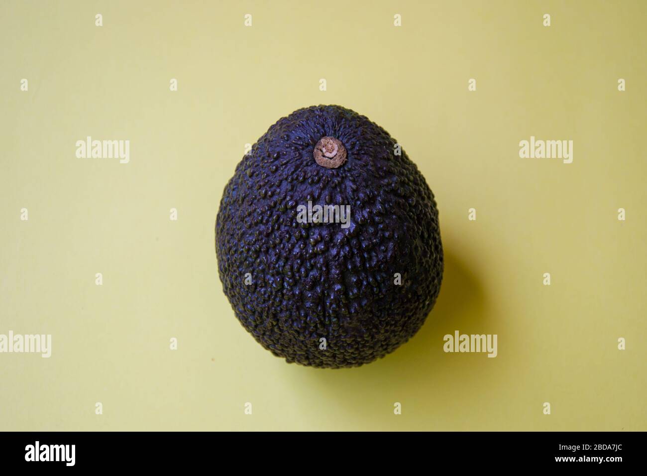 Whole green ripe avocado, close-up fruit, healthy eating concept ...