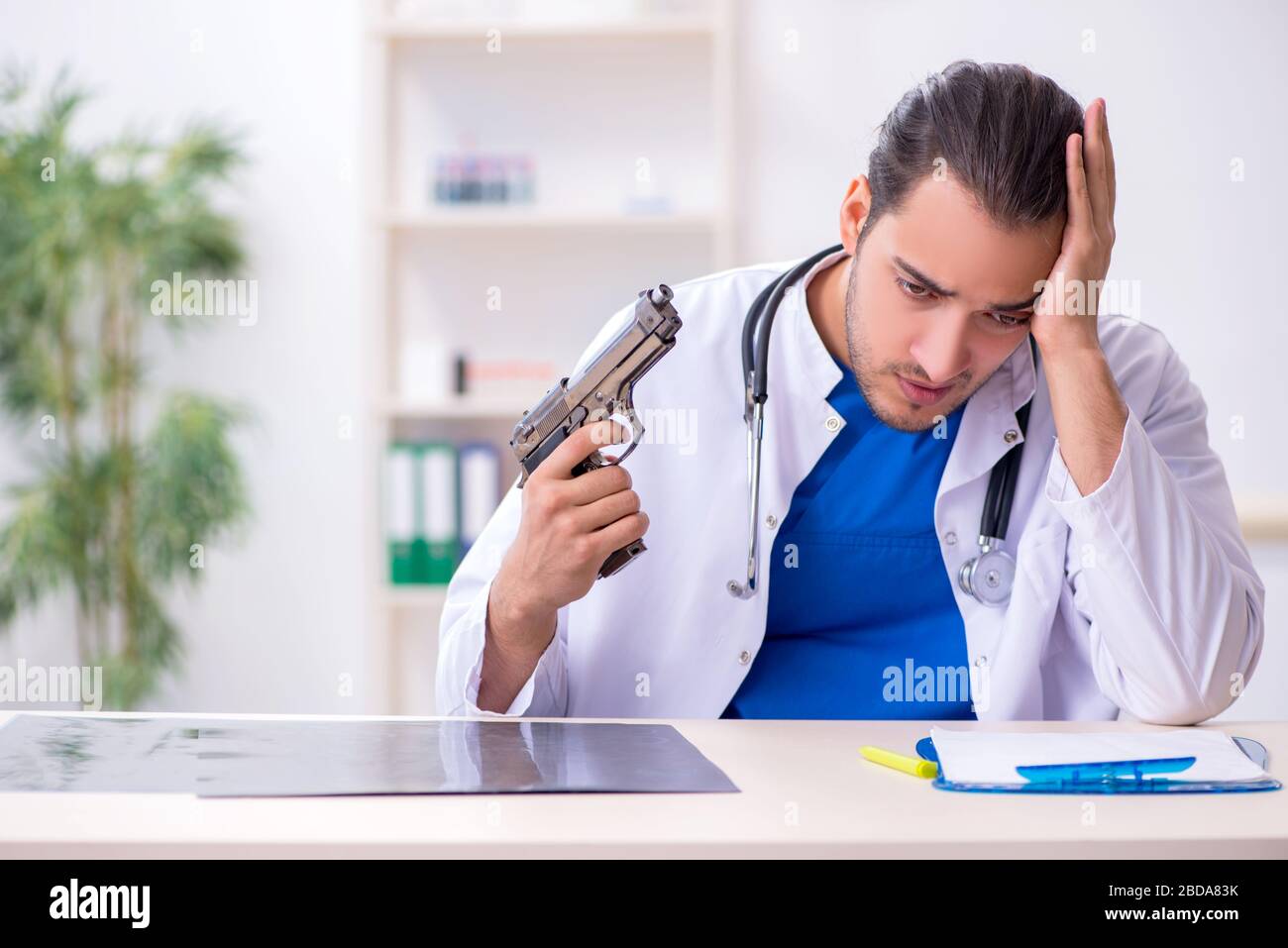 Young doctor being tired after night shift Stock Photo - Alamy