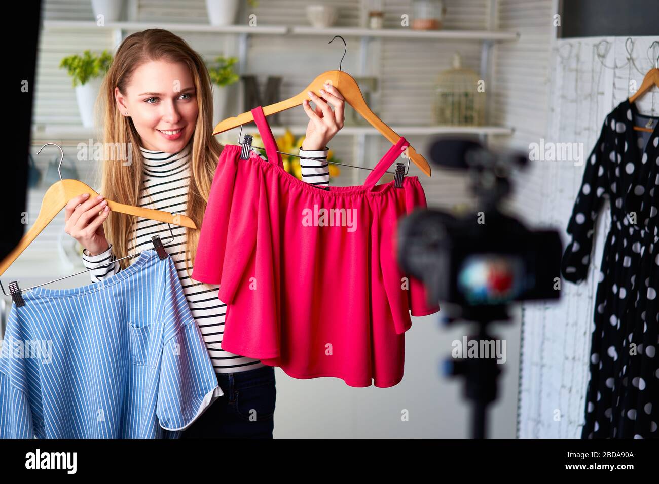 Fashion blogger woman in jeans and turtleneck showing casual colorful ...