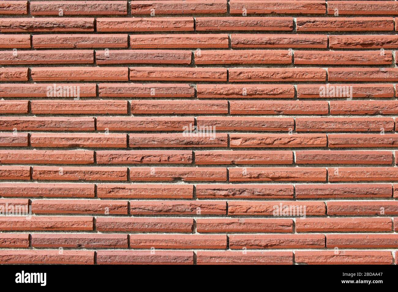 Vintage red color rustic texture brick wall background with striped ...