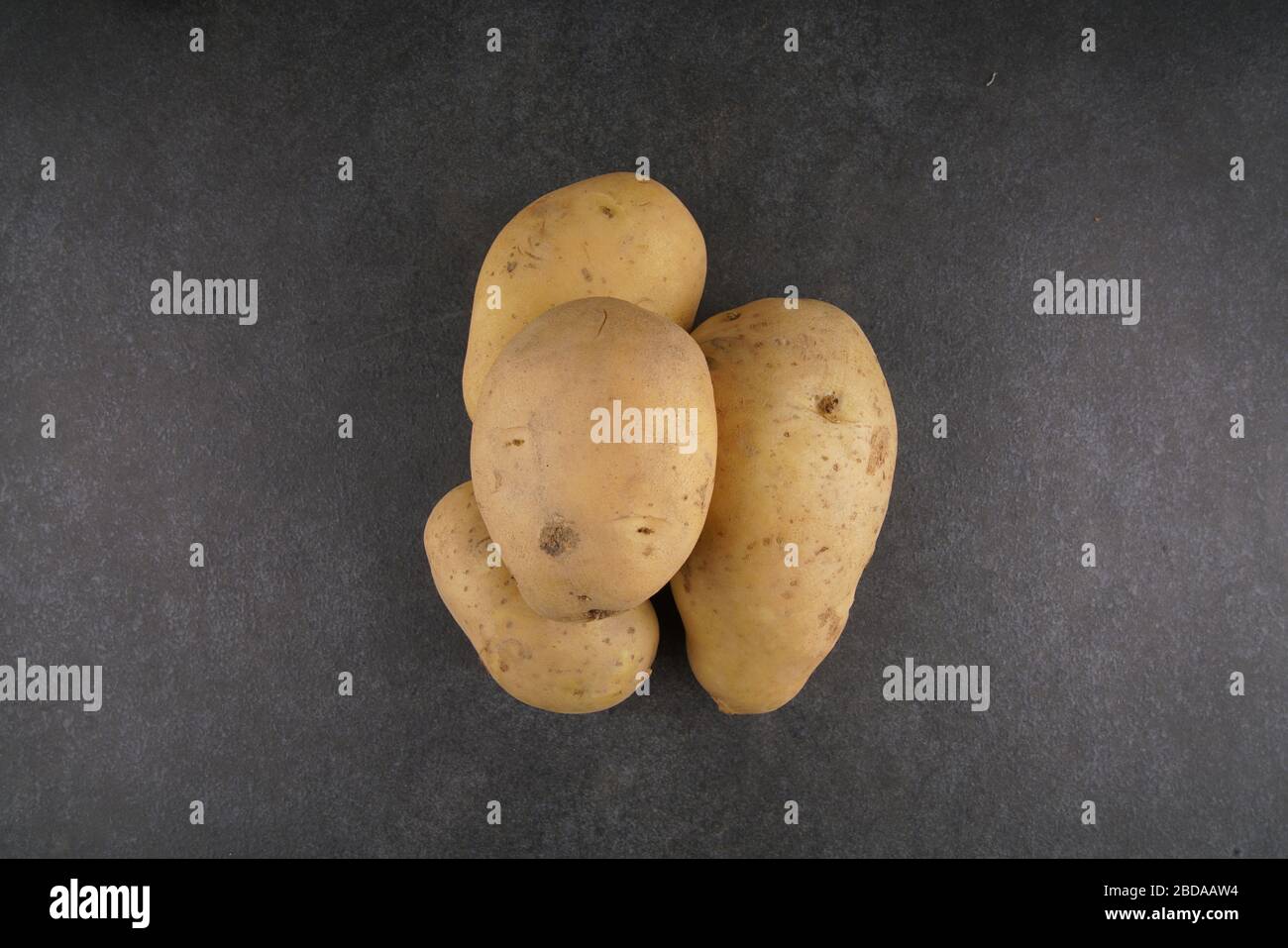 Fresh patato on dark background Stock Photo - Alamy