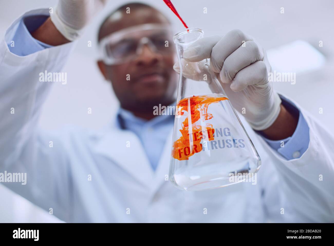 Skilled biologist studying viruses in the lab Stock Photo - Alamy