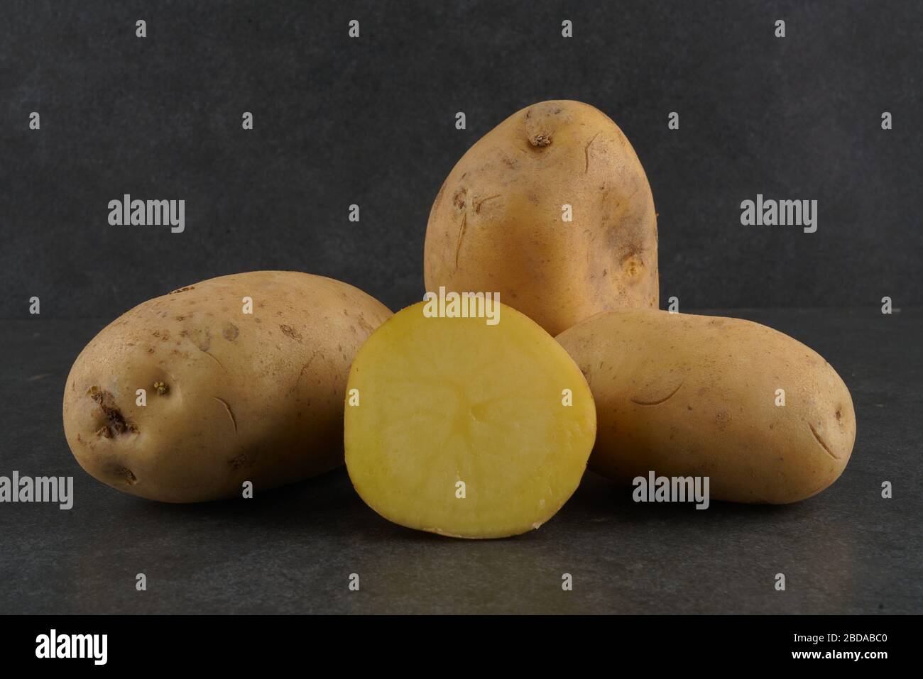 Fresh patato on dark background Stock Photo - Alamy