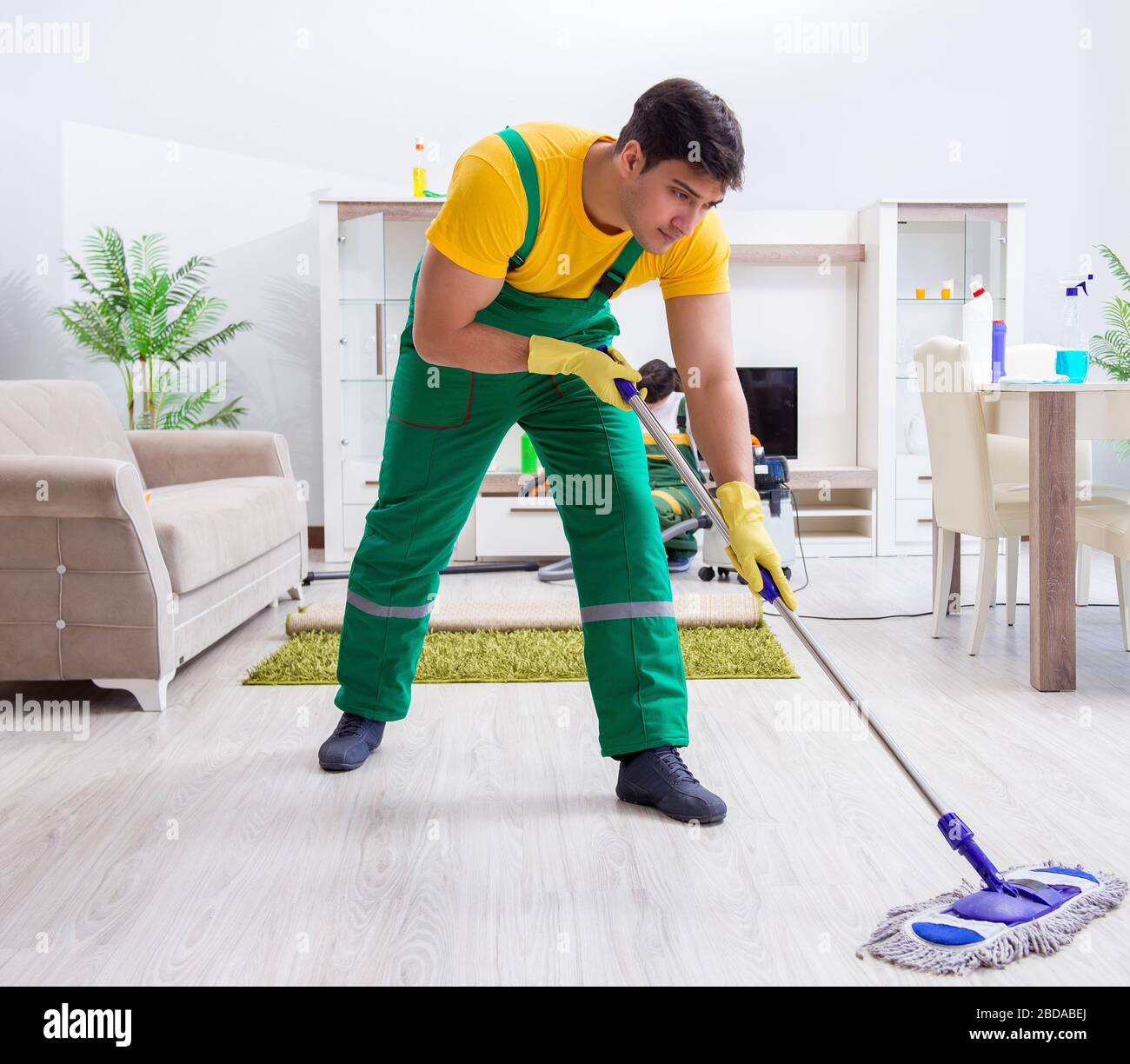 The professional cleaning contractor working at home Stock Photo - Alamy