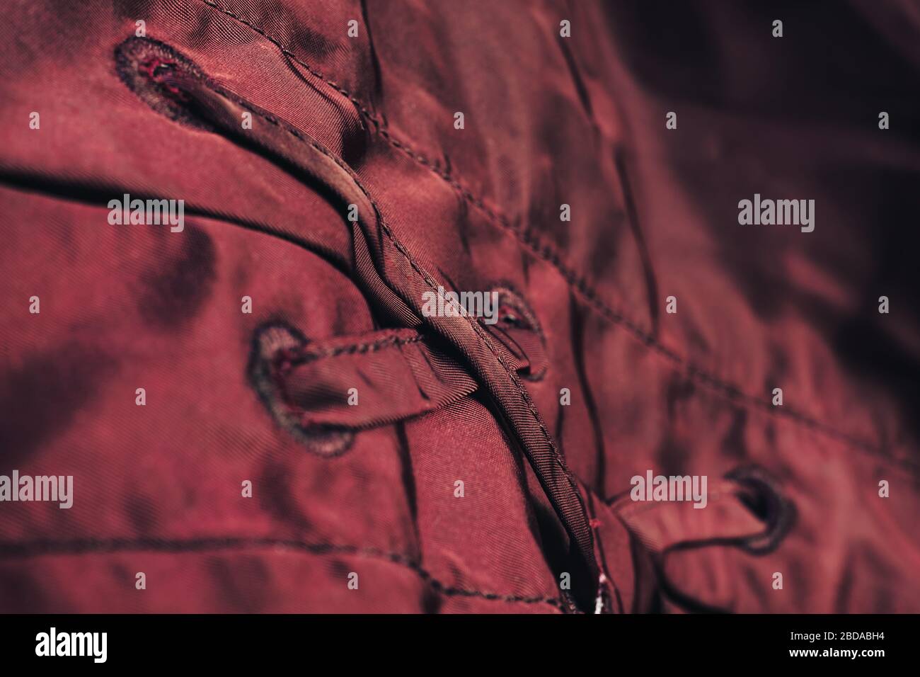 Close up beautiful red textile cloth background with stitching. Macro ...