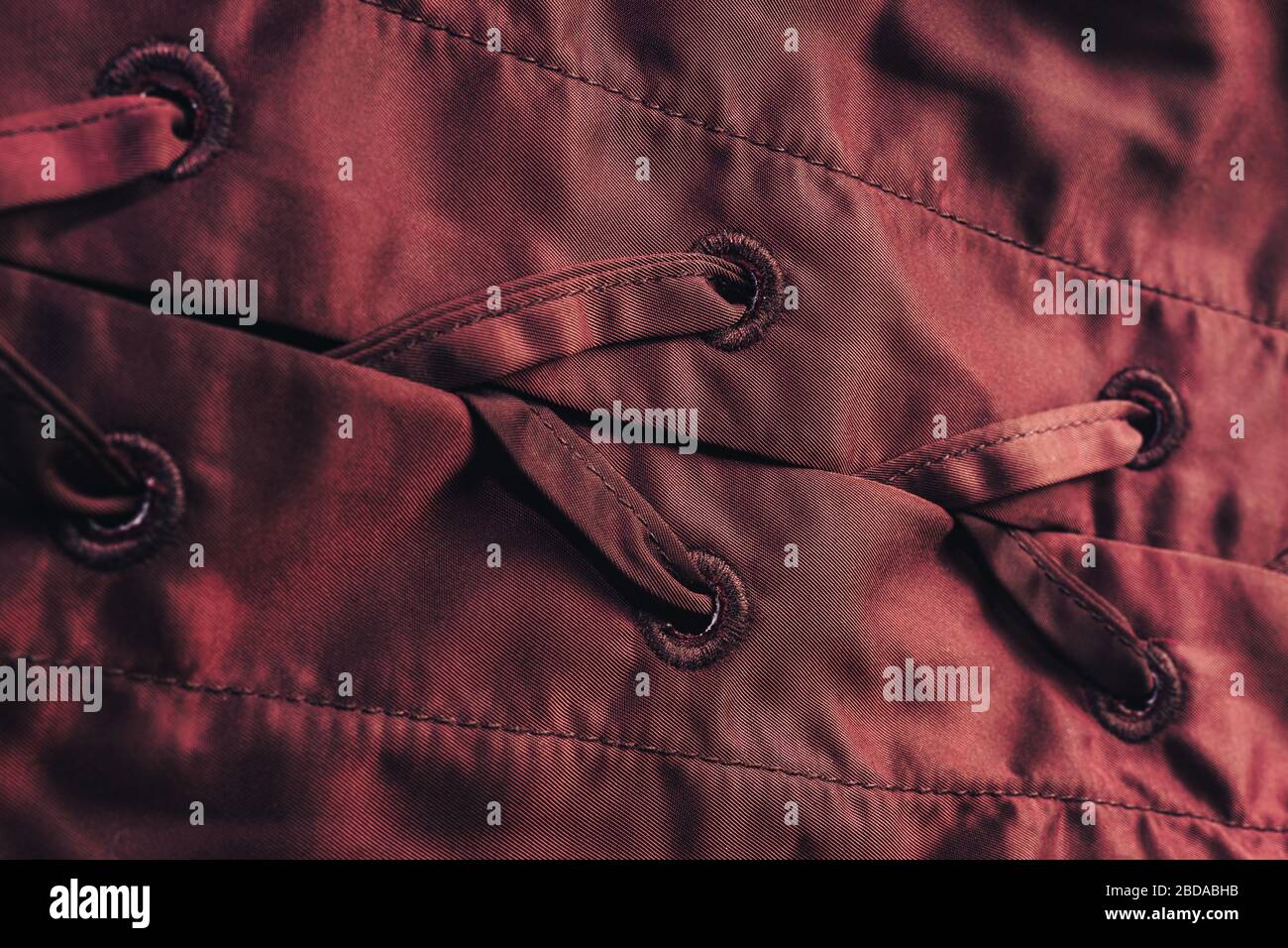 Close up beautiful red textile cloth background with stitching. Macro ...