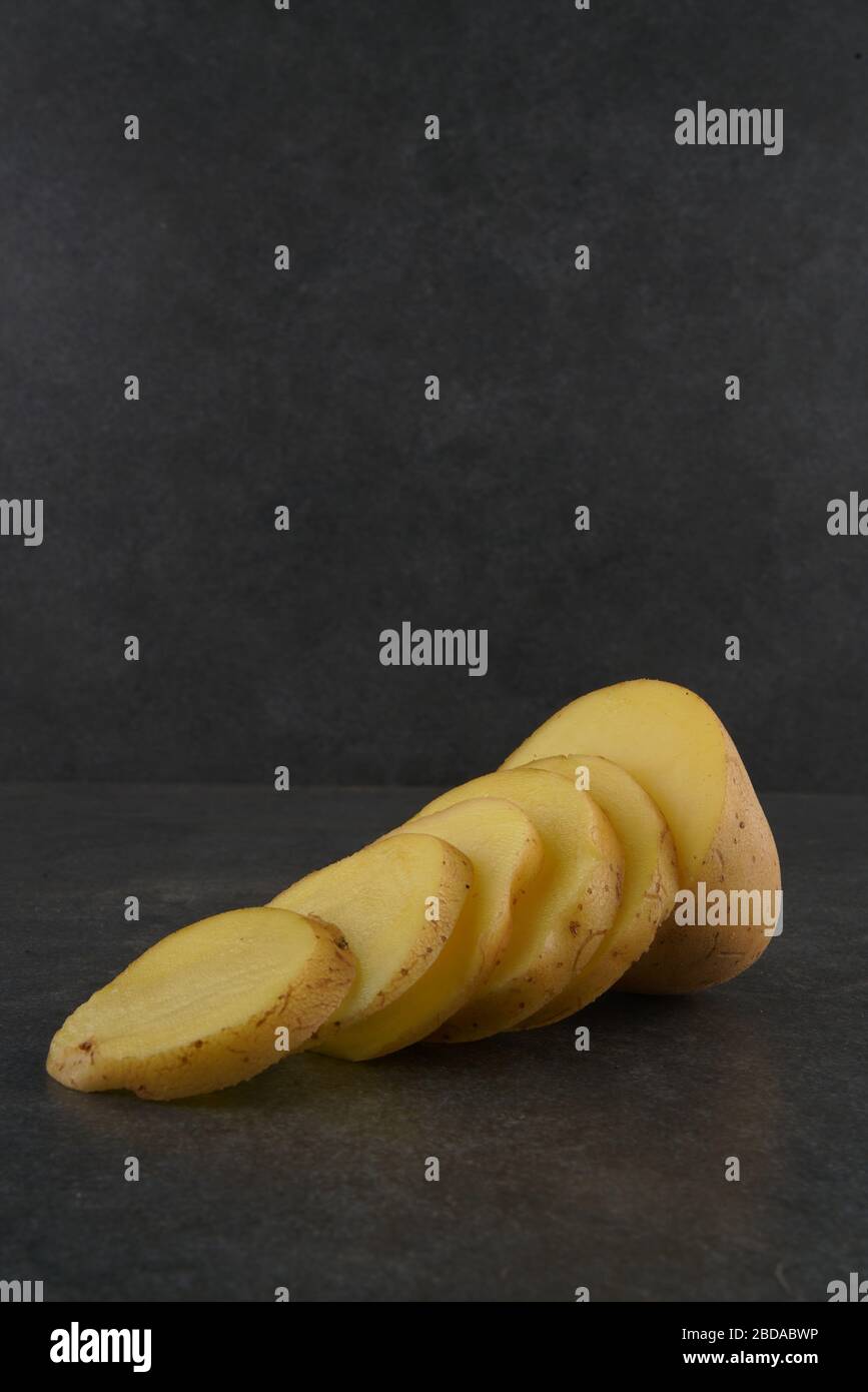 Fresh patato on dark background Stock Photo - Alamy
