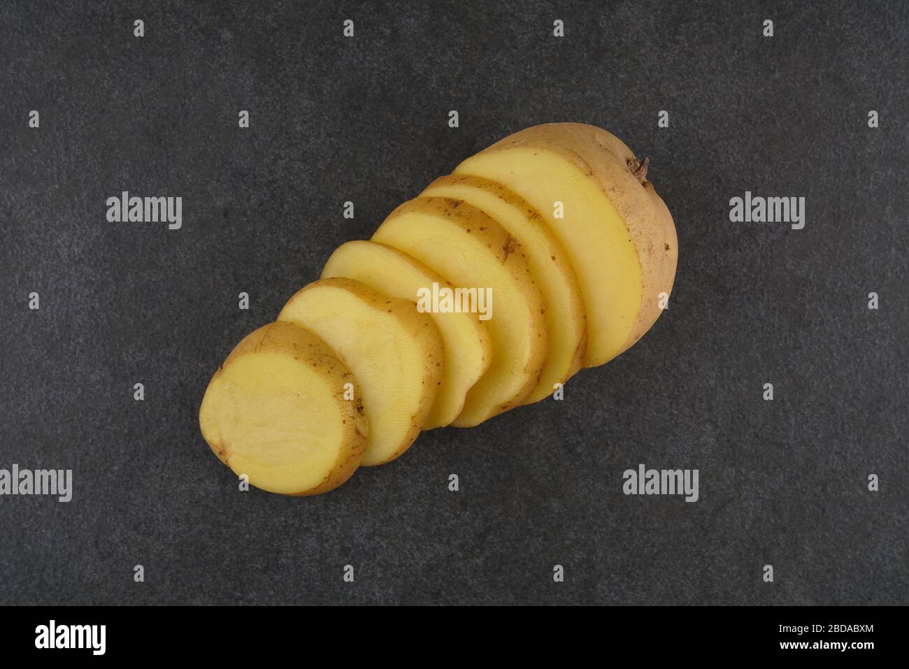 Fresh patato on dark background Stock Photo - Alamy