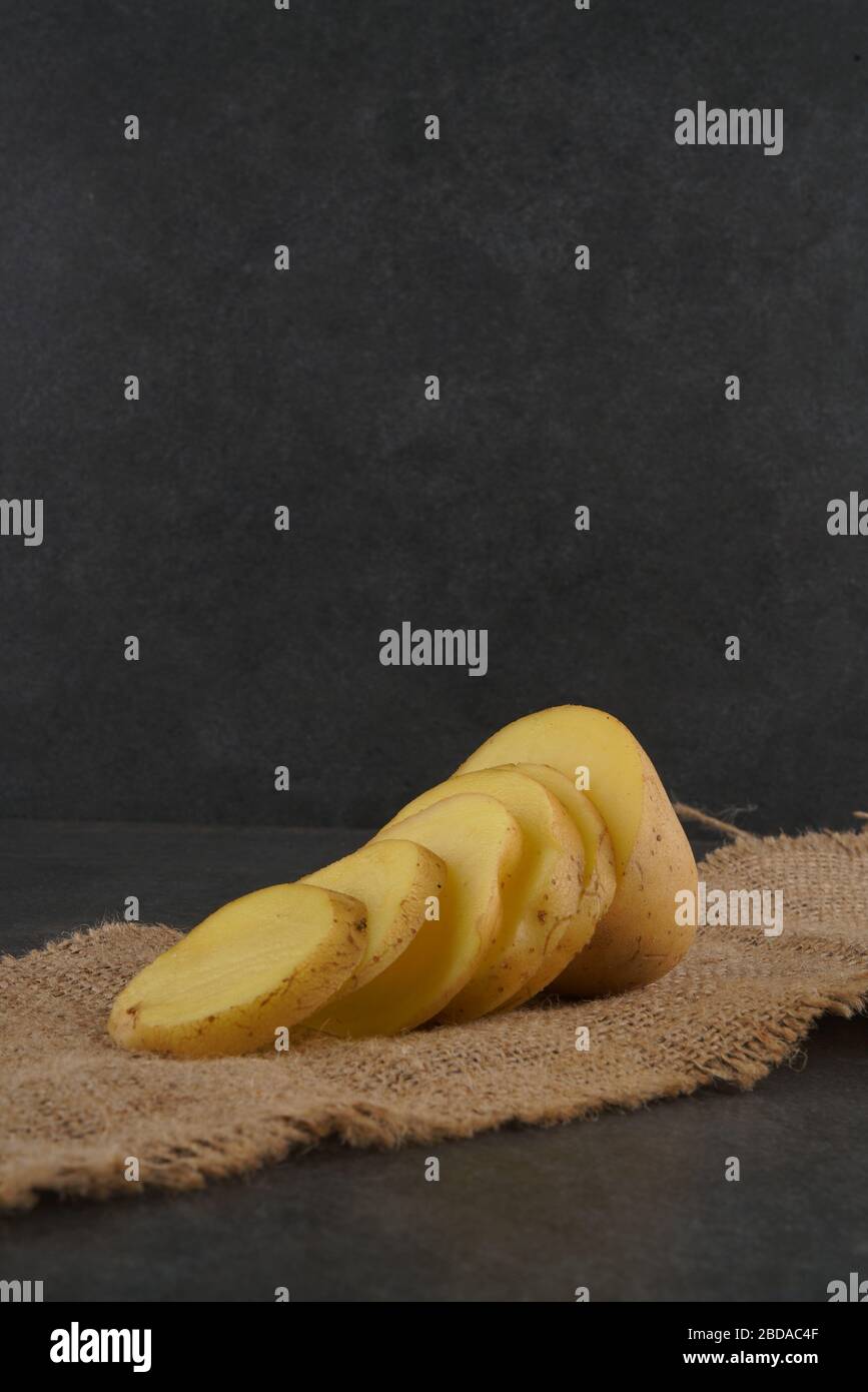 Fresh patato on dark background Stock Photo - Alamy
