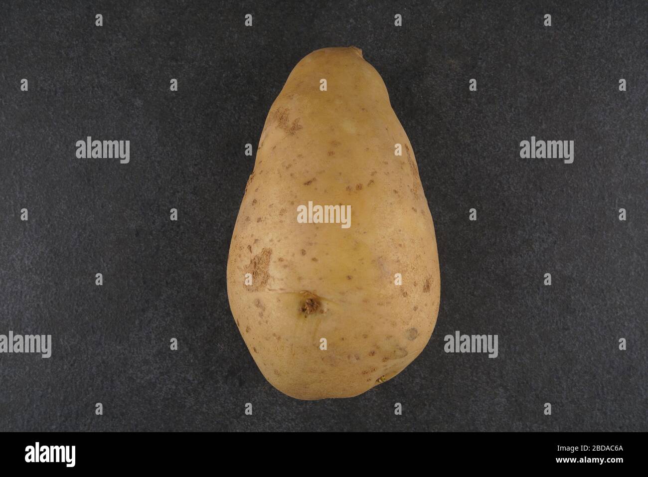 Fresh patato on dark background Stock Photo - Alamy