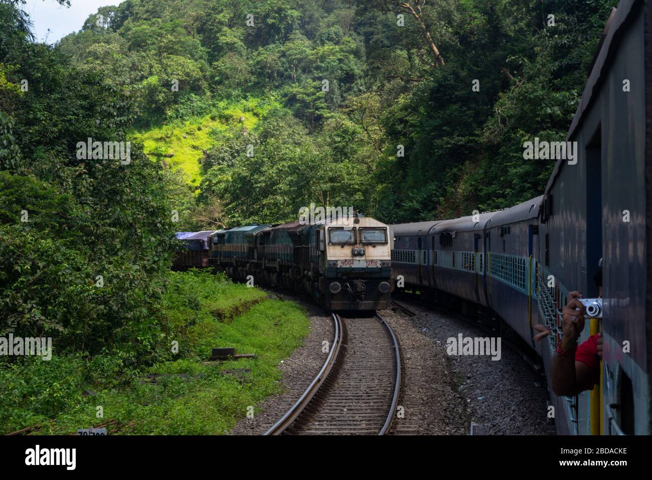 Helper engines pushing a freight train up the gradient of Braganza Ghat ...
