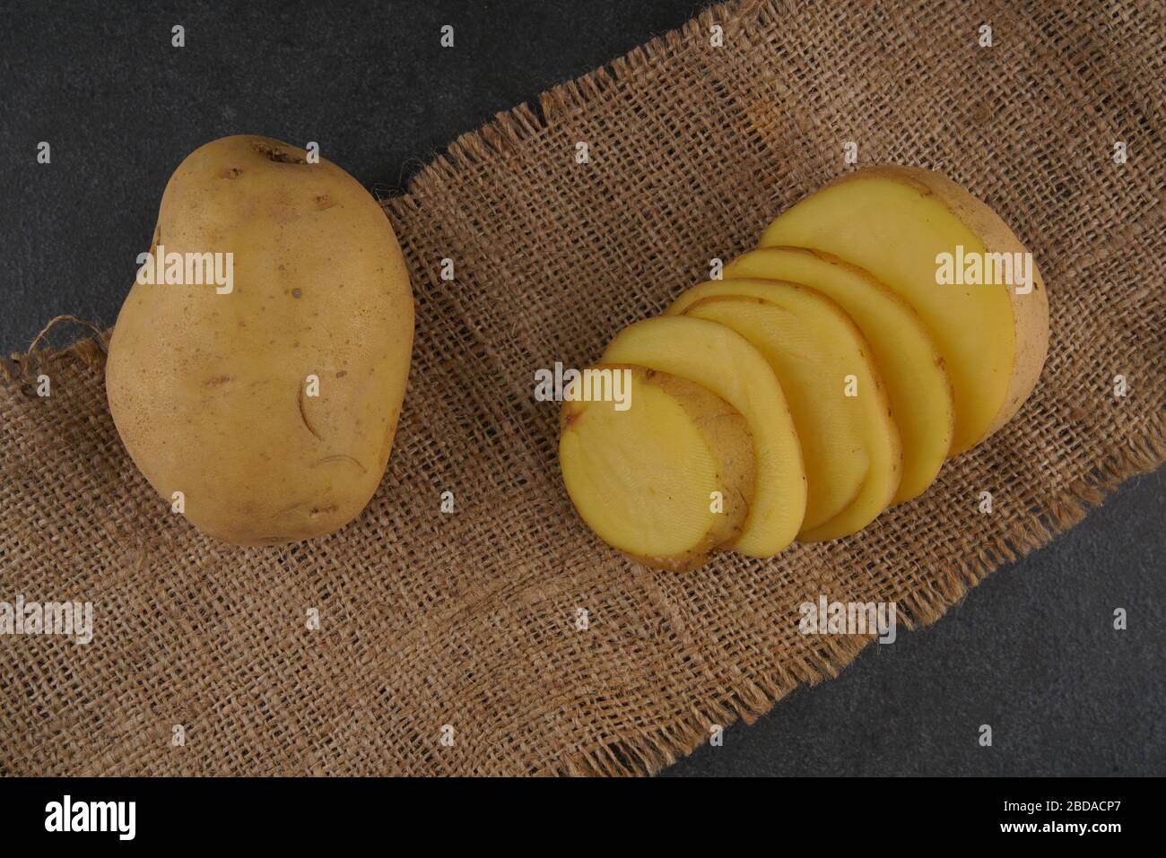 Fresh patato on dark background Stock Photo - Alamy