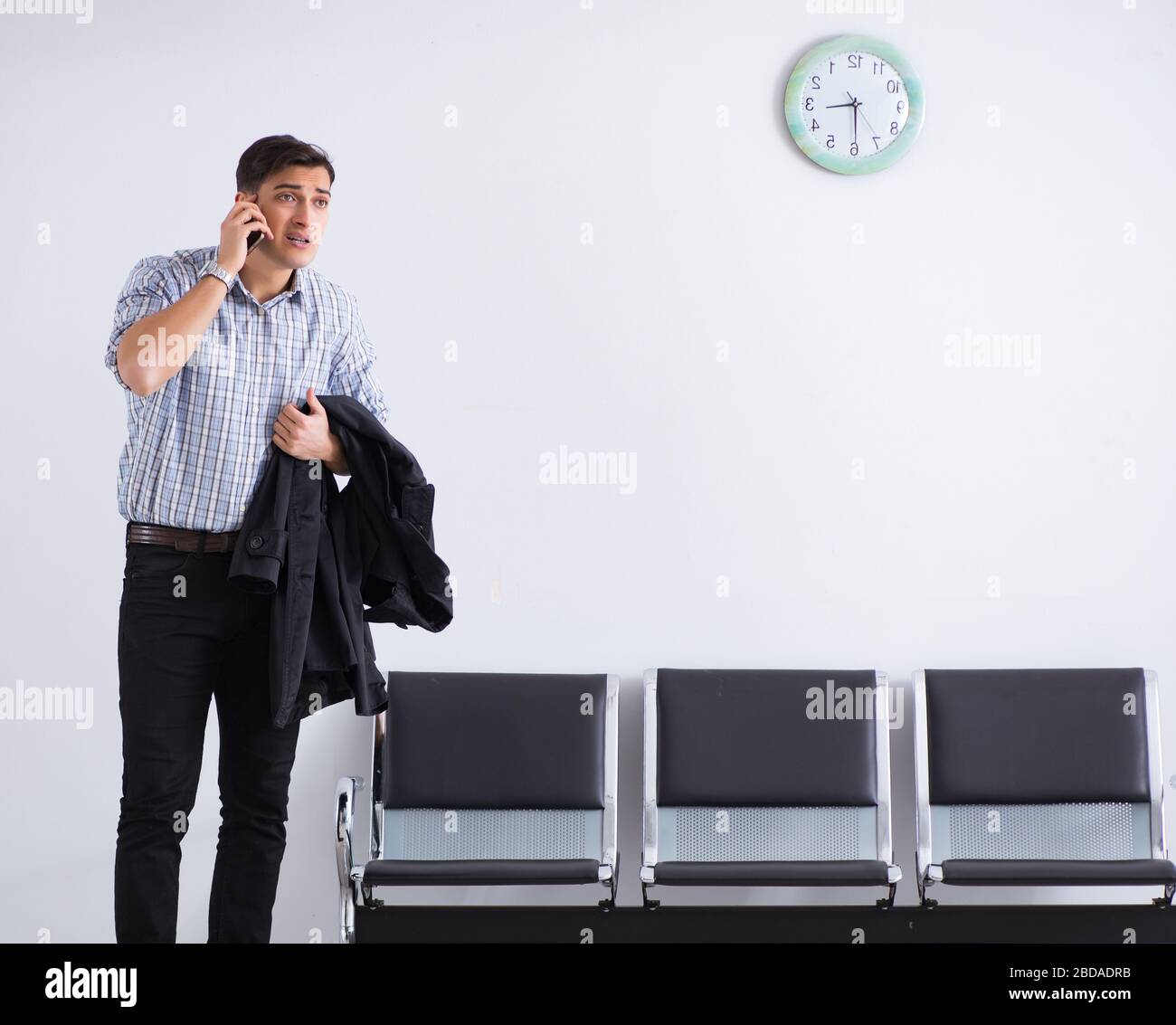 The man nervously impatiently waiting in the lobby Stock Photo - Alamy