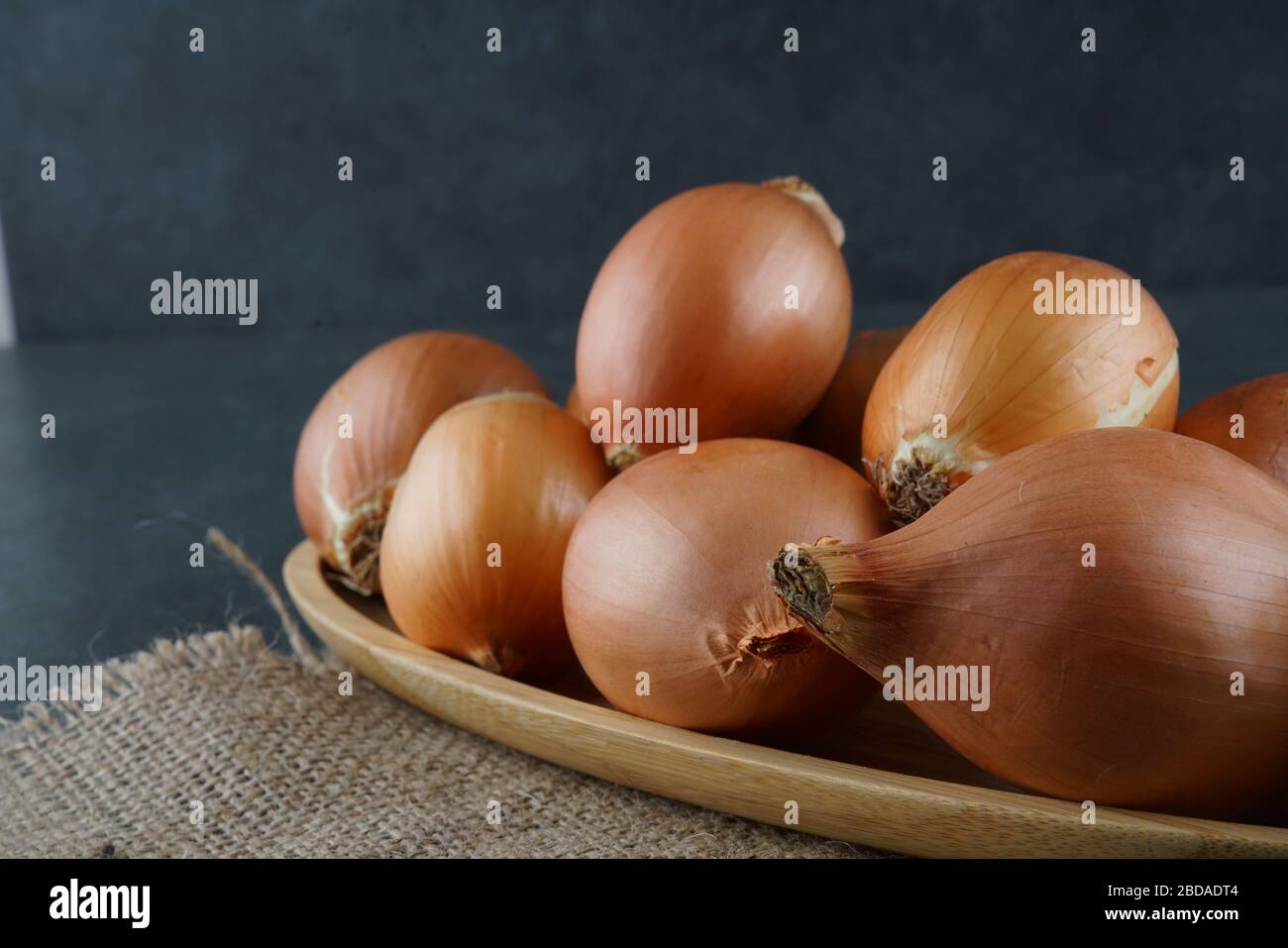 fresh gold onion on dark background Stock Photo - Alamy