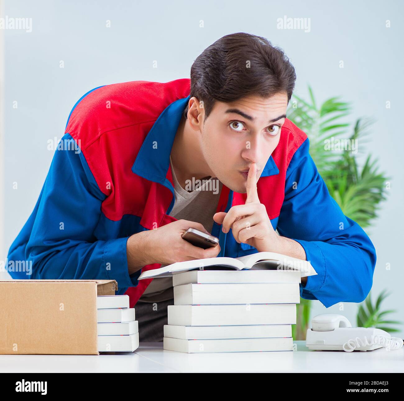 The worker in publishing house preparing book order Stock Photo - Alamy