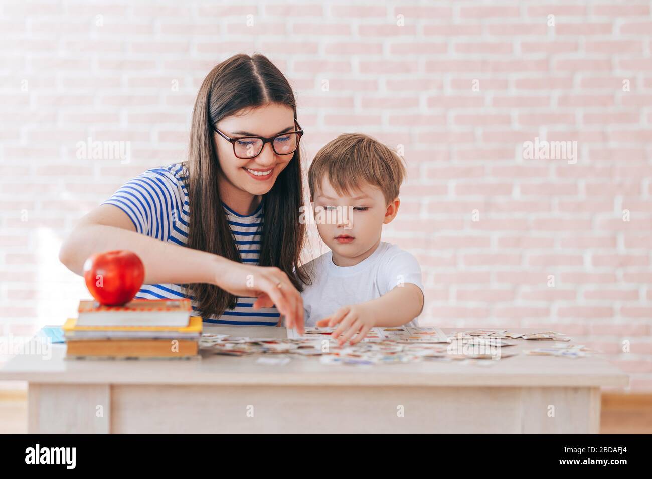 Teaching children with parents Stock Photo - Alamy