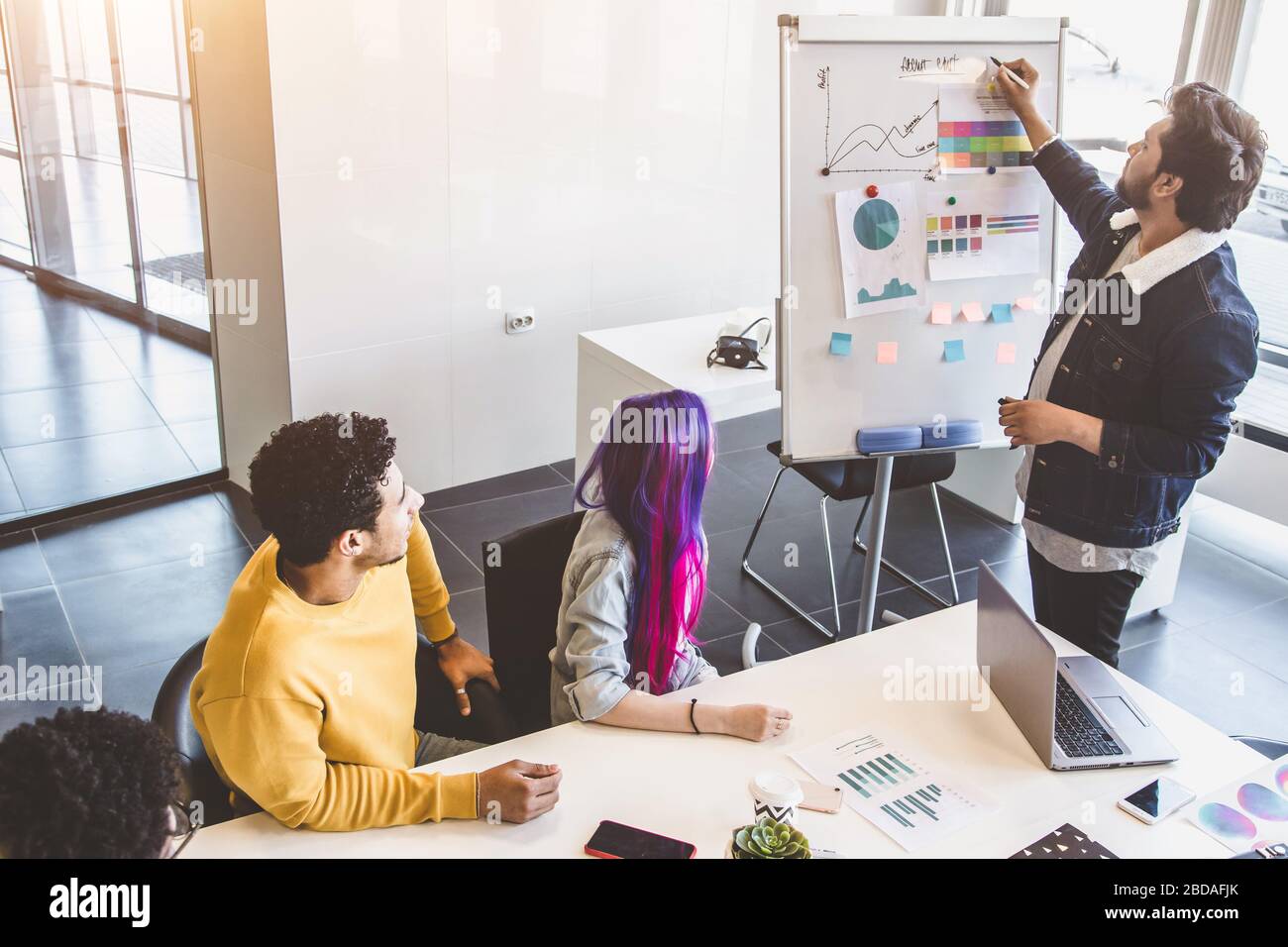 Executives sitting around conference table hi-res stock photography and ...