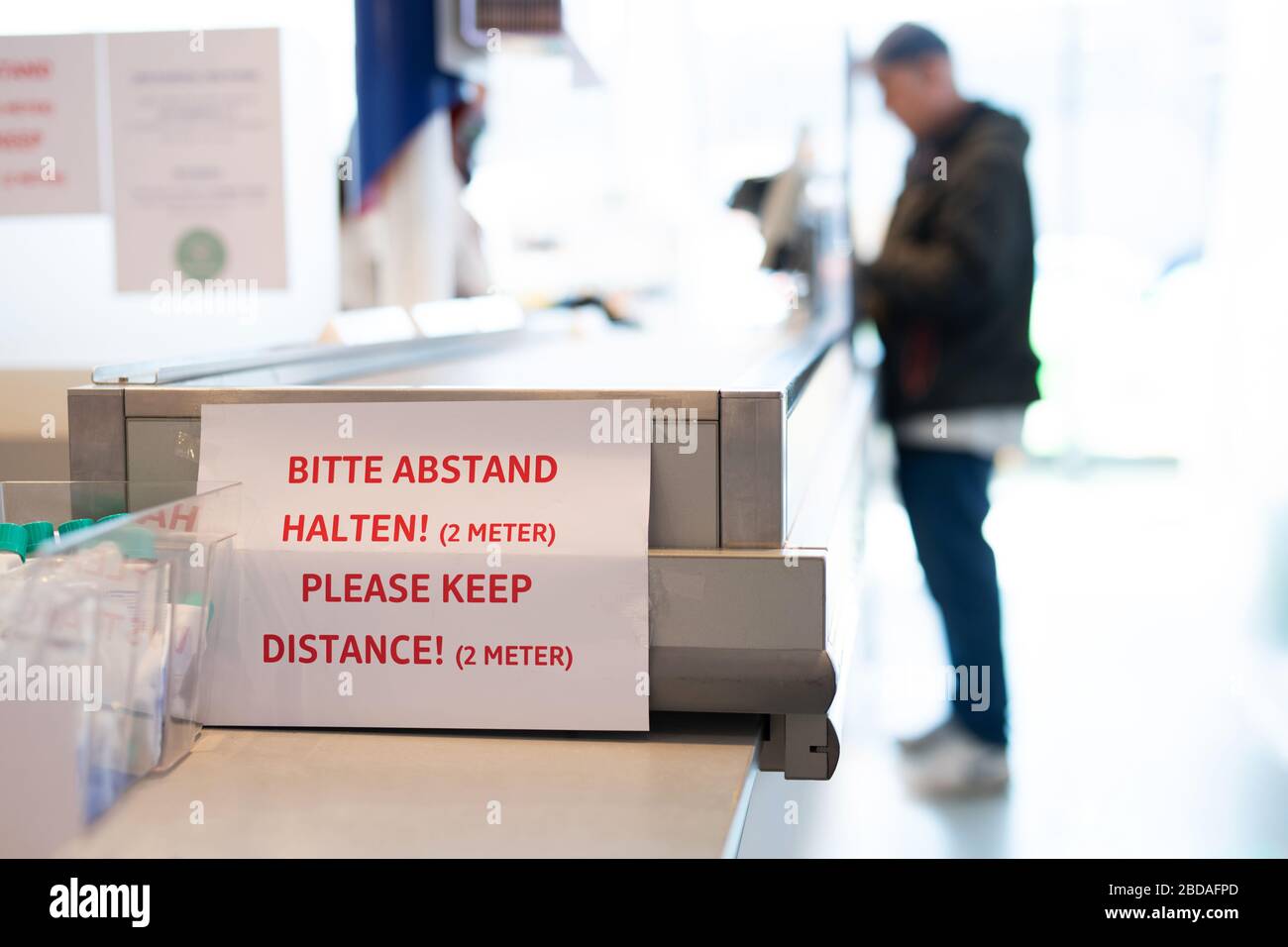 Warning sign in the supermarket to keep distance to avoid getting ...